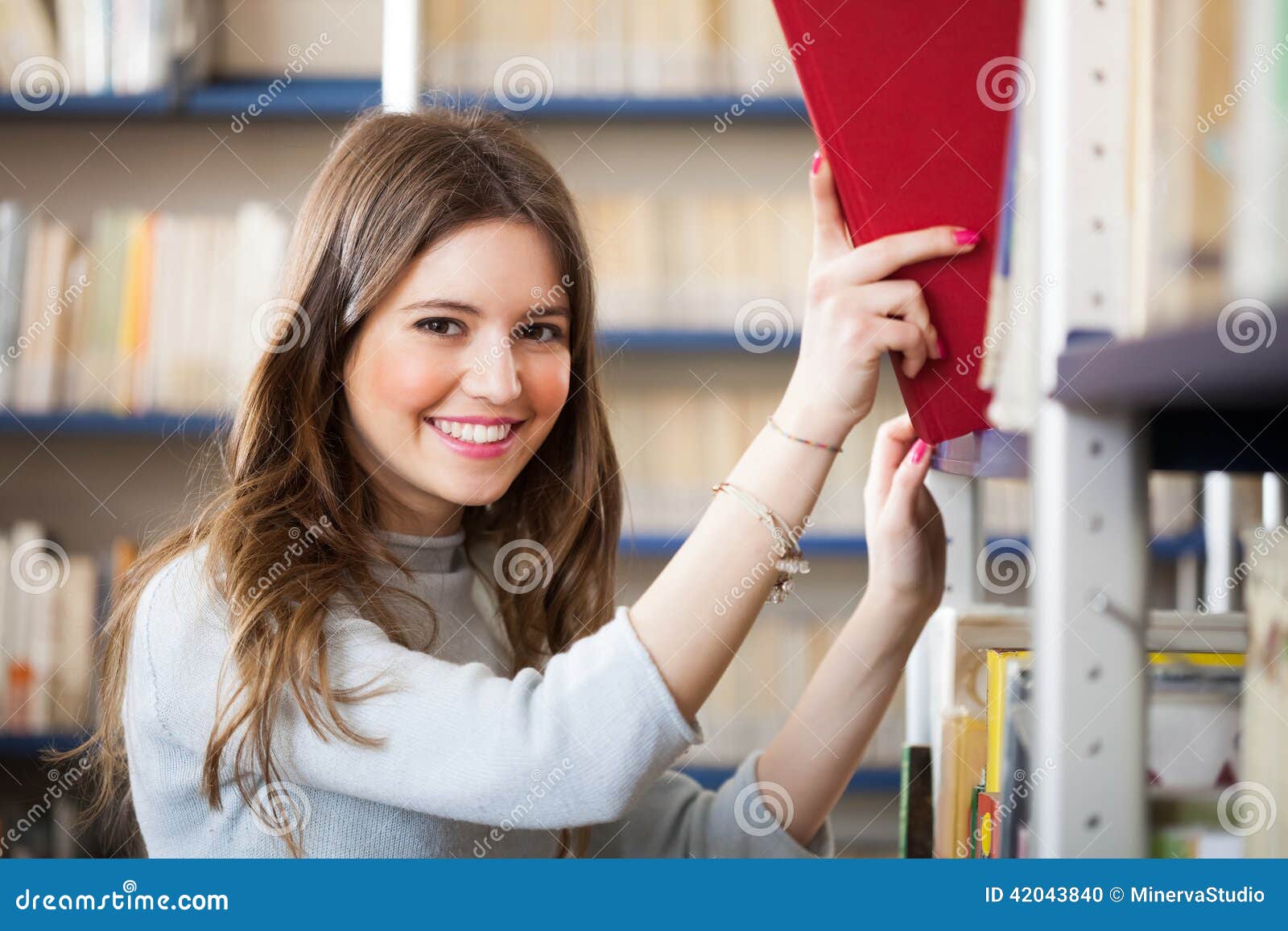 Girl Taking a Book in a Library Stock Photo - Image of taking, book ...