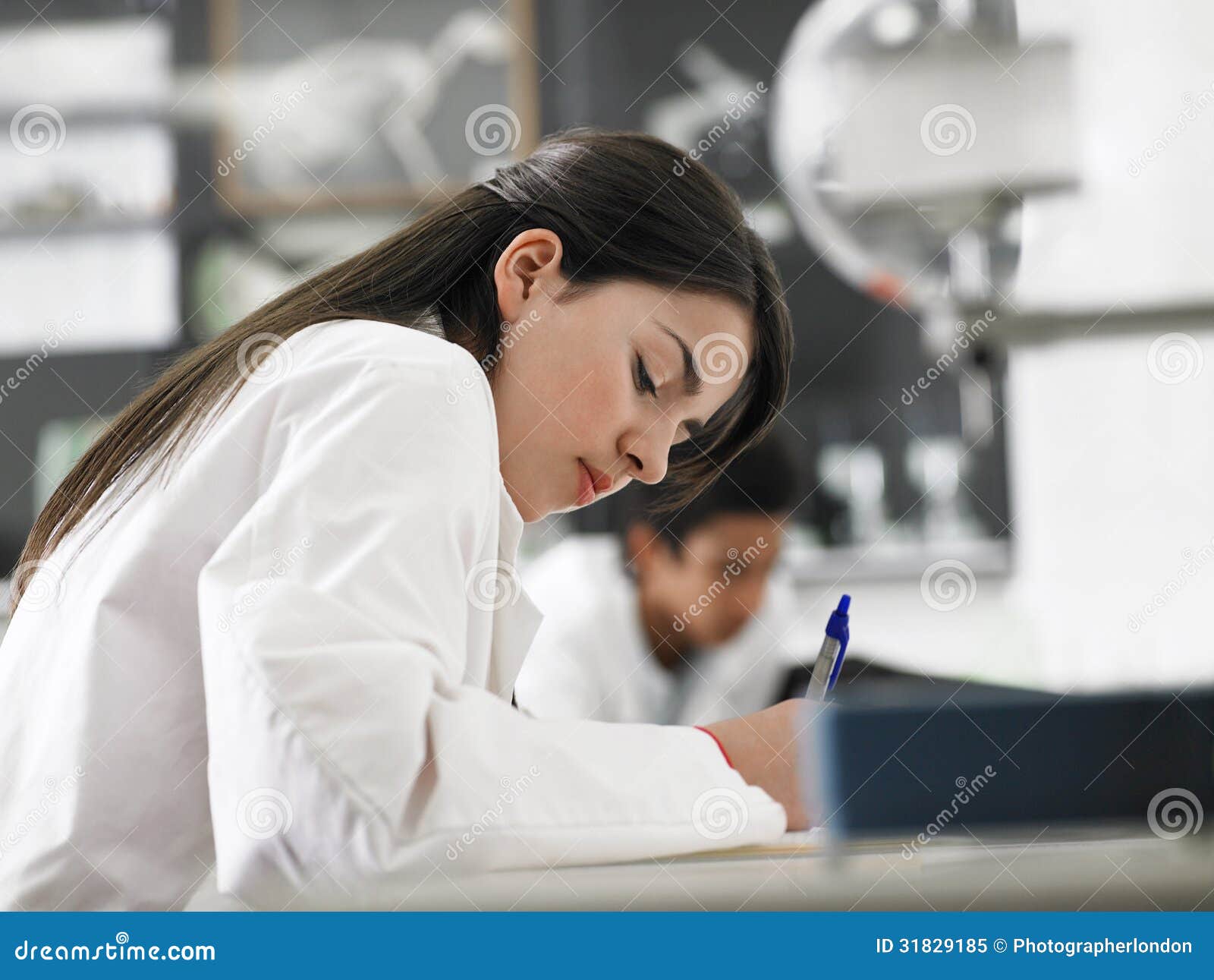 Girl Taking Notes in Science Class Stock Image - Image of learning ...