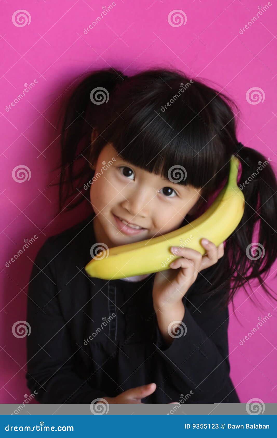 Girl talking on a Banana stock image. Image of happy, funny - 9355123