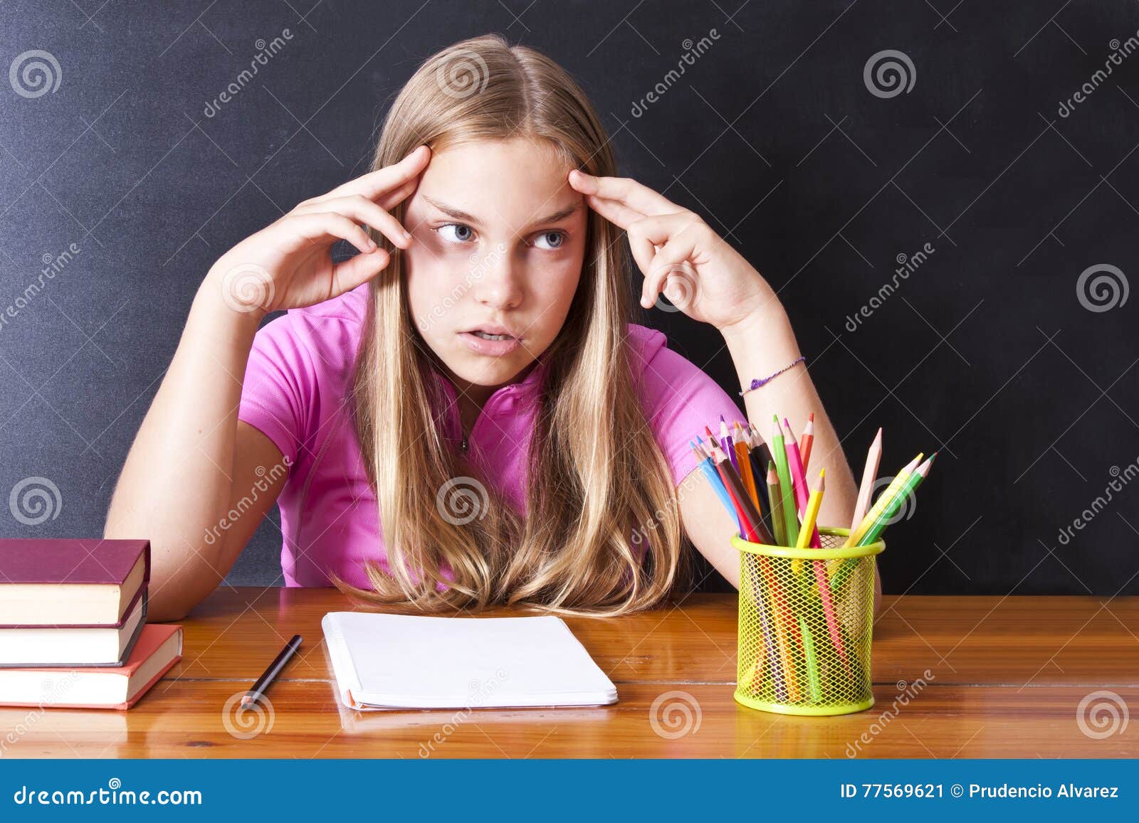 Girl thinking in school stock image. Image of education - 77569621
