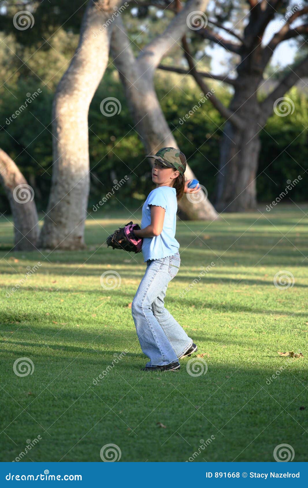 Girl throwing a ball stock photo. Image of long, denim - 891668