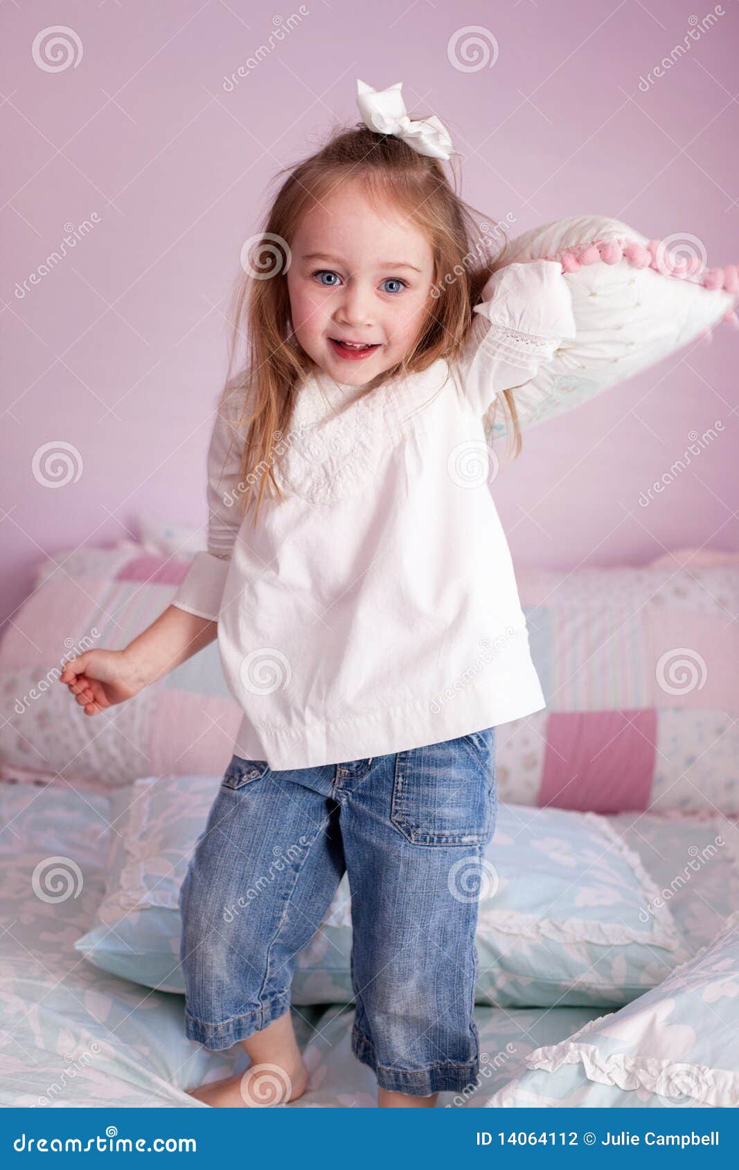 Girl throwing a pillow stock photo. Image of throw, bedroom - 14064112