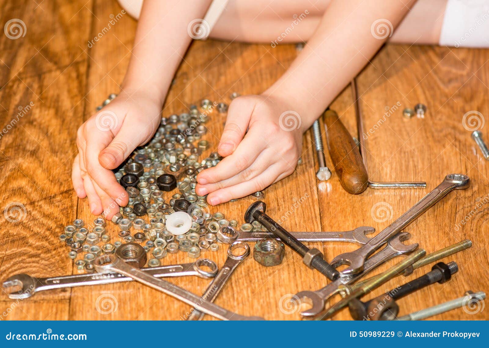 Girl with tools in hands stock image. Image of model - 50989229
