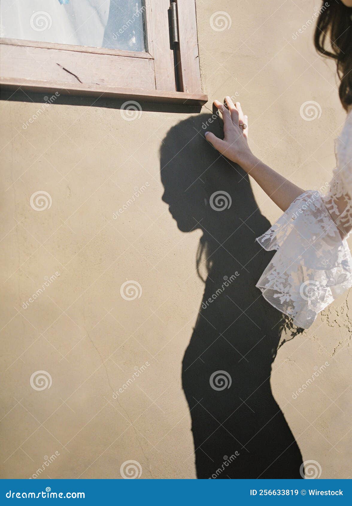 Girl Touching Her Shadow on the Wall by Side, Vertical Shot Stock Image ...