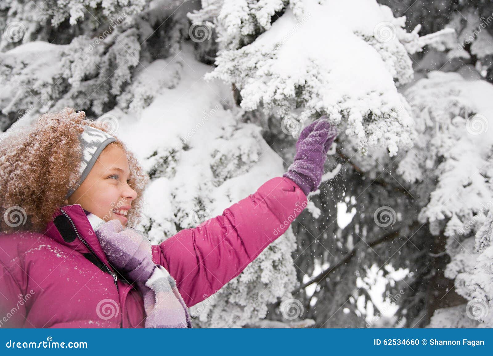 Girl Touching Snow on a Branch Stock Photo - Image of arms, cold: 62534660