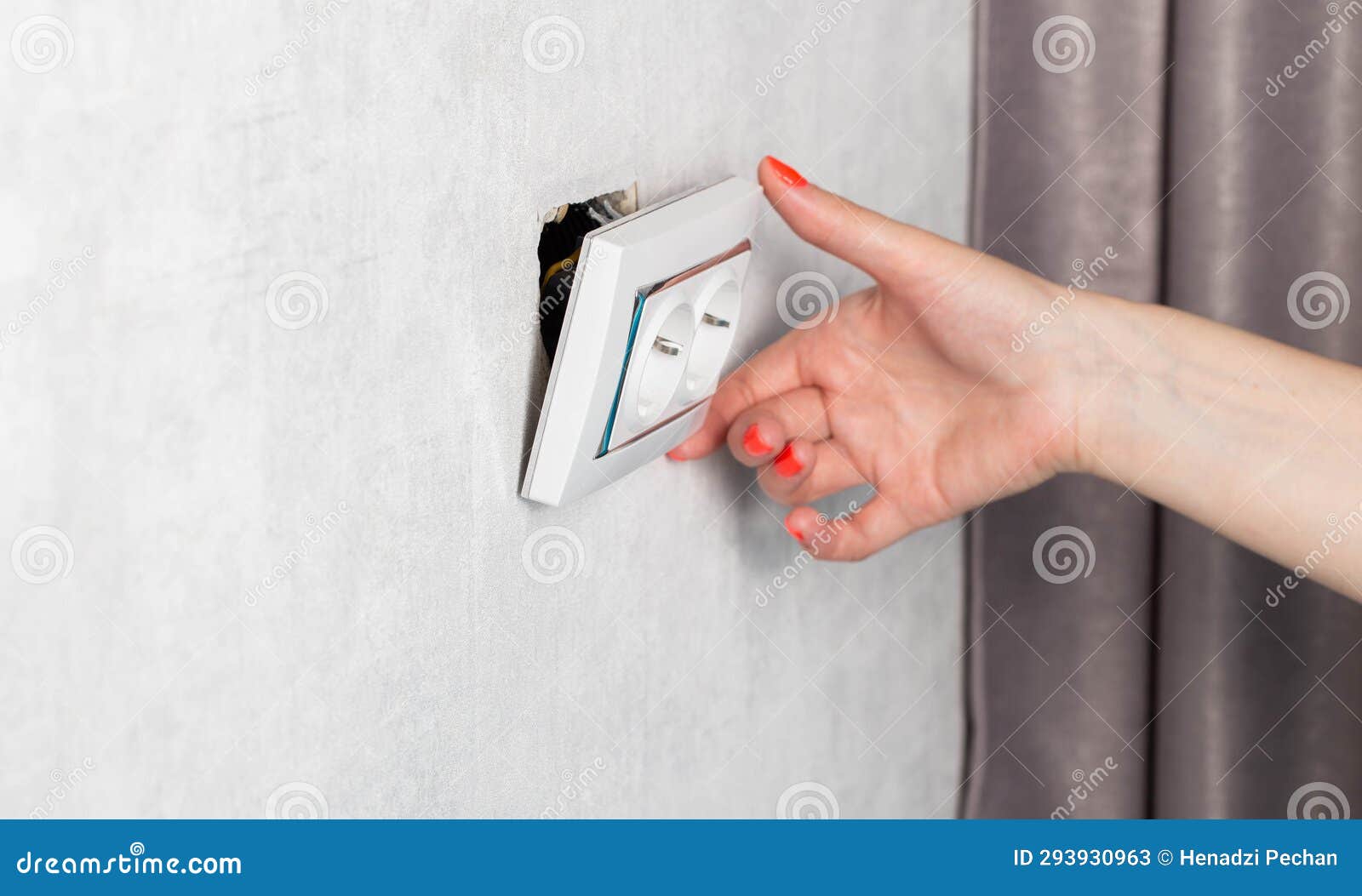 Pulling An Electrical Cable Out Of A Wall Socket To Save Energy Royalty ...