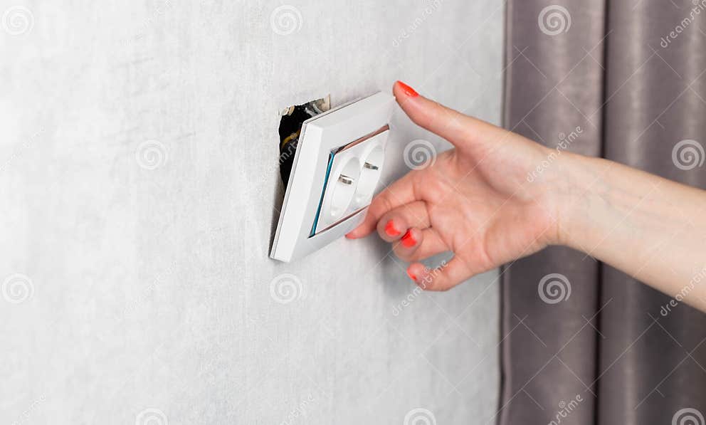 The Girl is Trying To Insert a Torn Out Socket from the Socket Due To ...