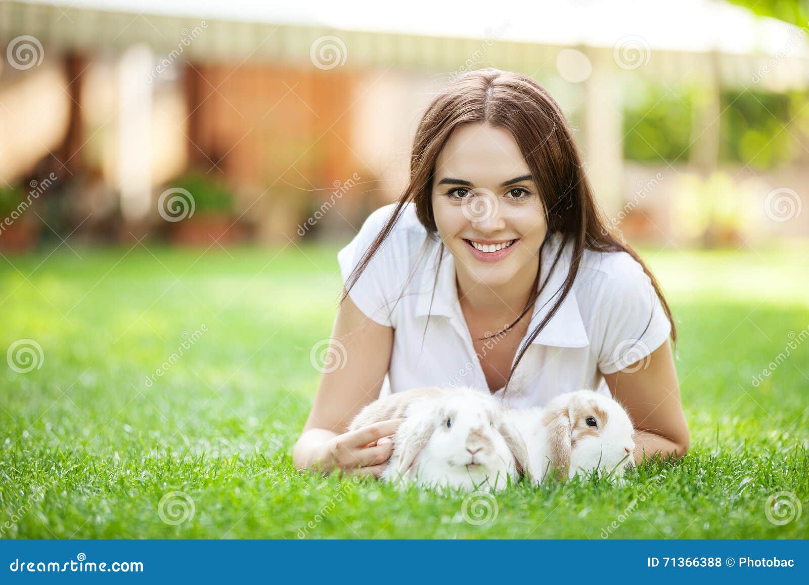 Girl with Two Pet Rabbit in a Park Stock Photo - Image of lying, care ...
