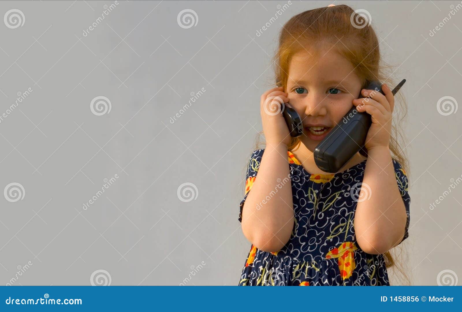 Girl with two phones stock photo. Image of mobile, telephone - 1458856