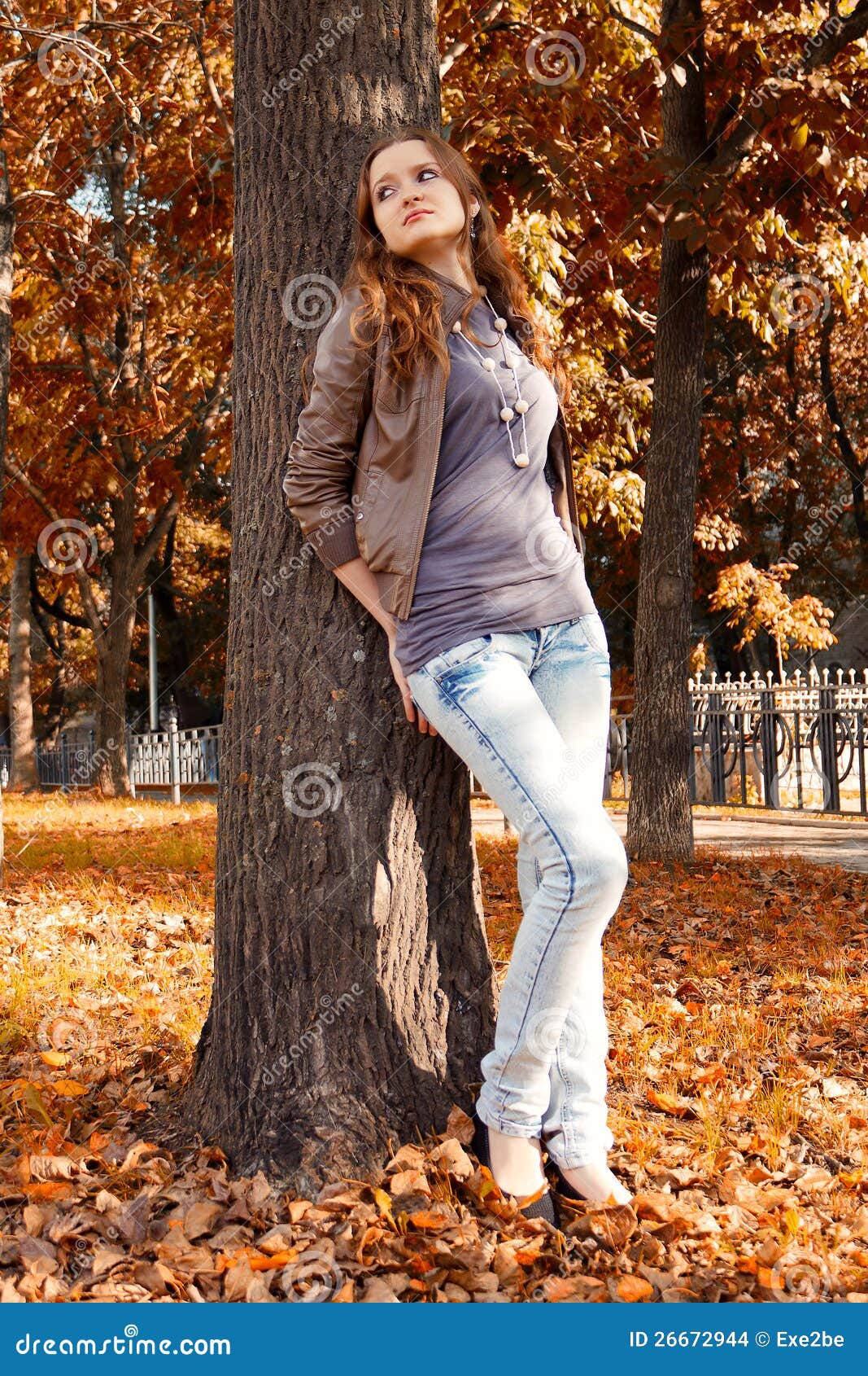 Girl under the tree stock photo. Image of beautiful, autumn - 26672944