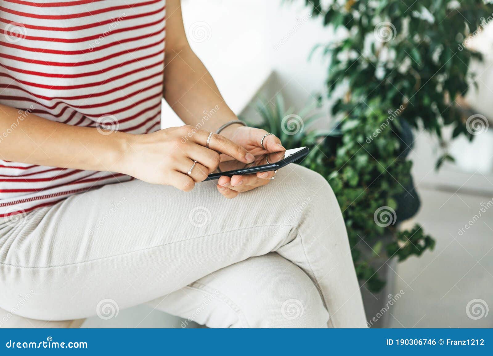A Girl is Using a Cell Phone Stock Photo - Image of hold, device: 190306746