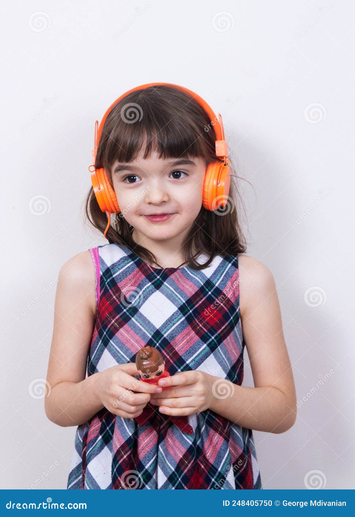 Girl using the earphones stock photo. Image of childhood - 248405750