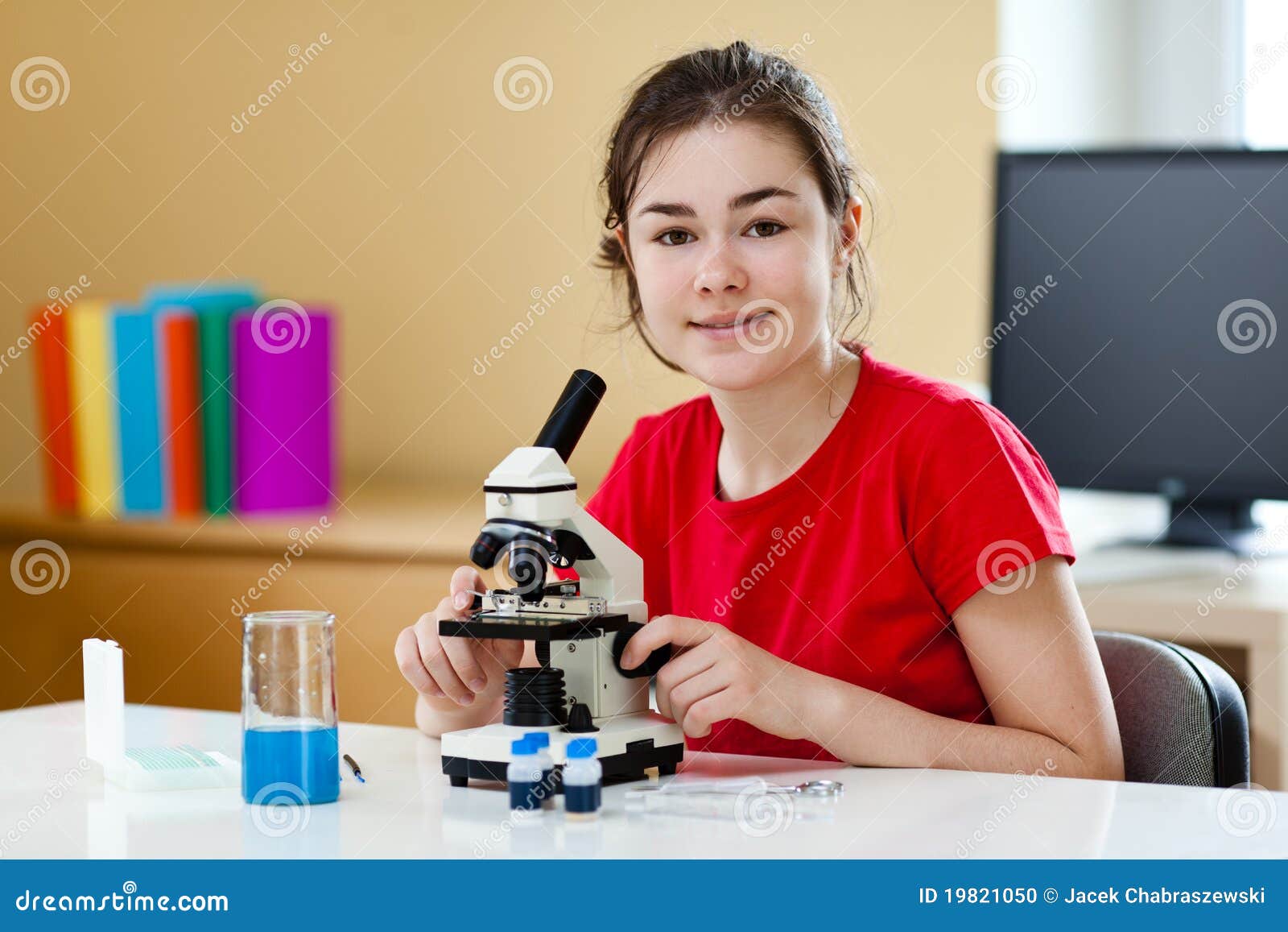 Girl using microscope stock photo. Image of classroom - 19821050