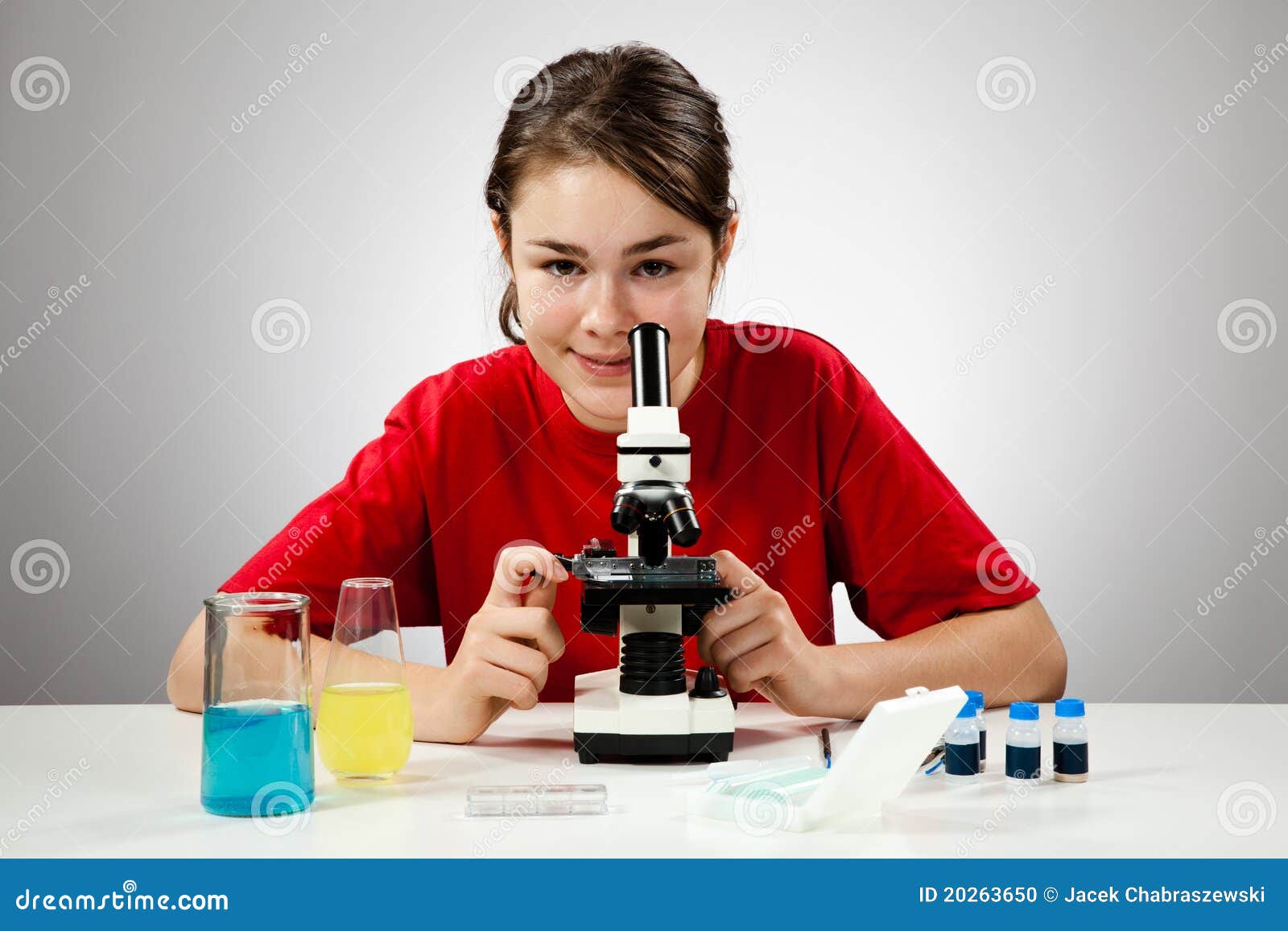 Girl using microscope stock photo. Image of look, close - 20263650