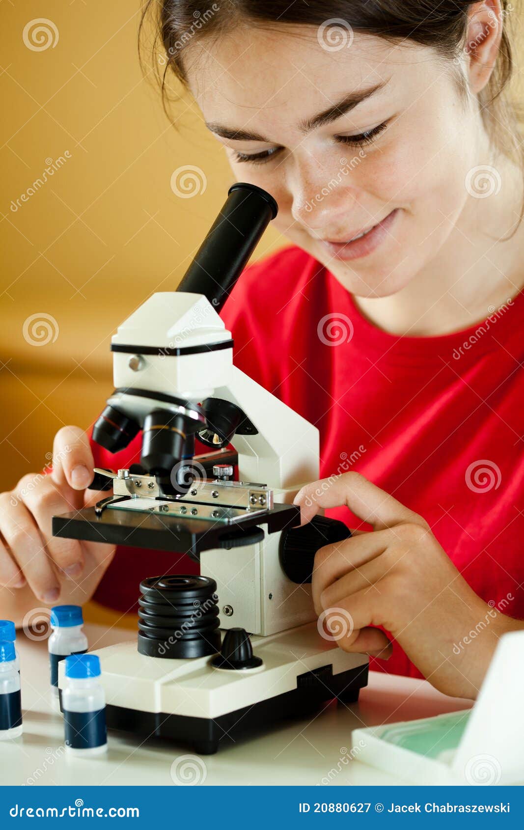 Girl using microscope stock image. Image of examining - 20880627