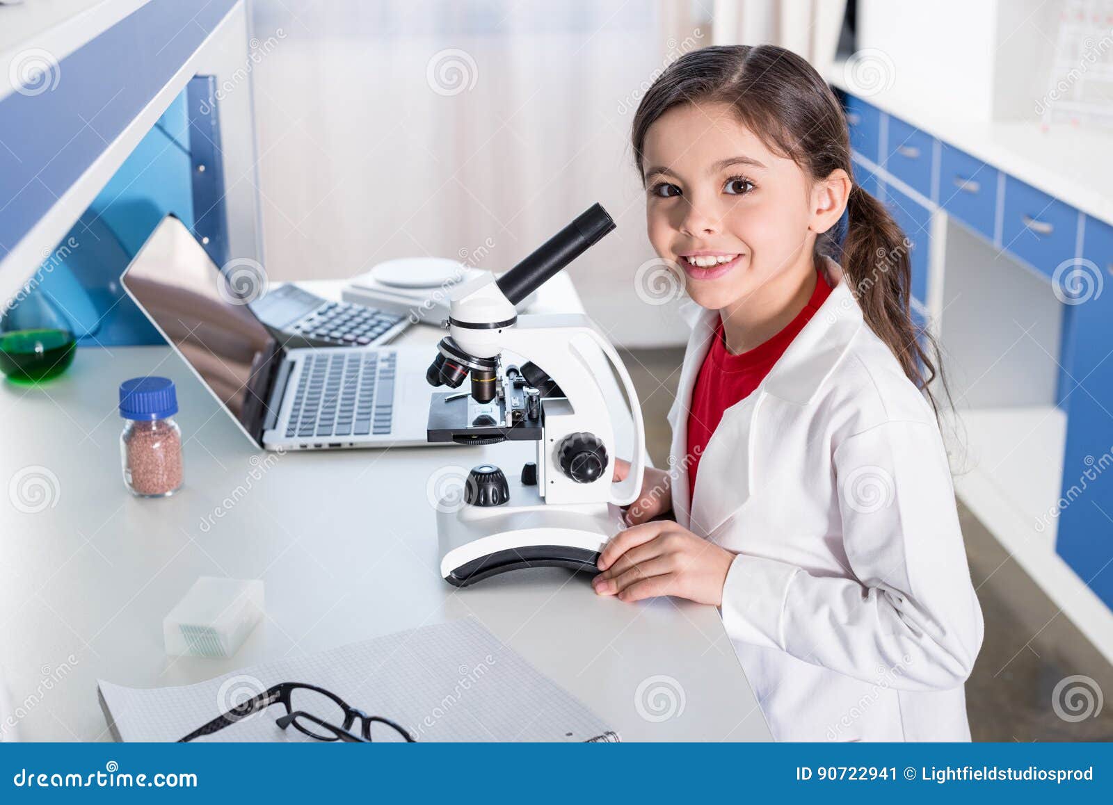Girl using microscope stock image. Image of child, youngster - 90722941