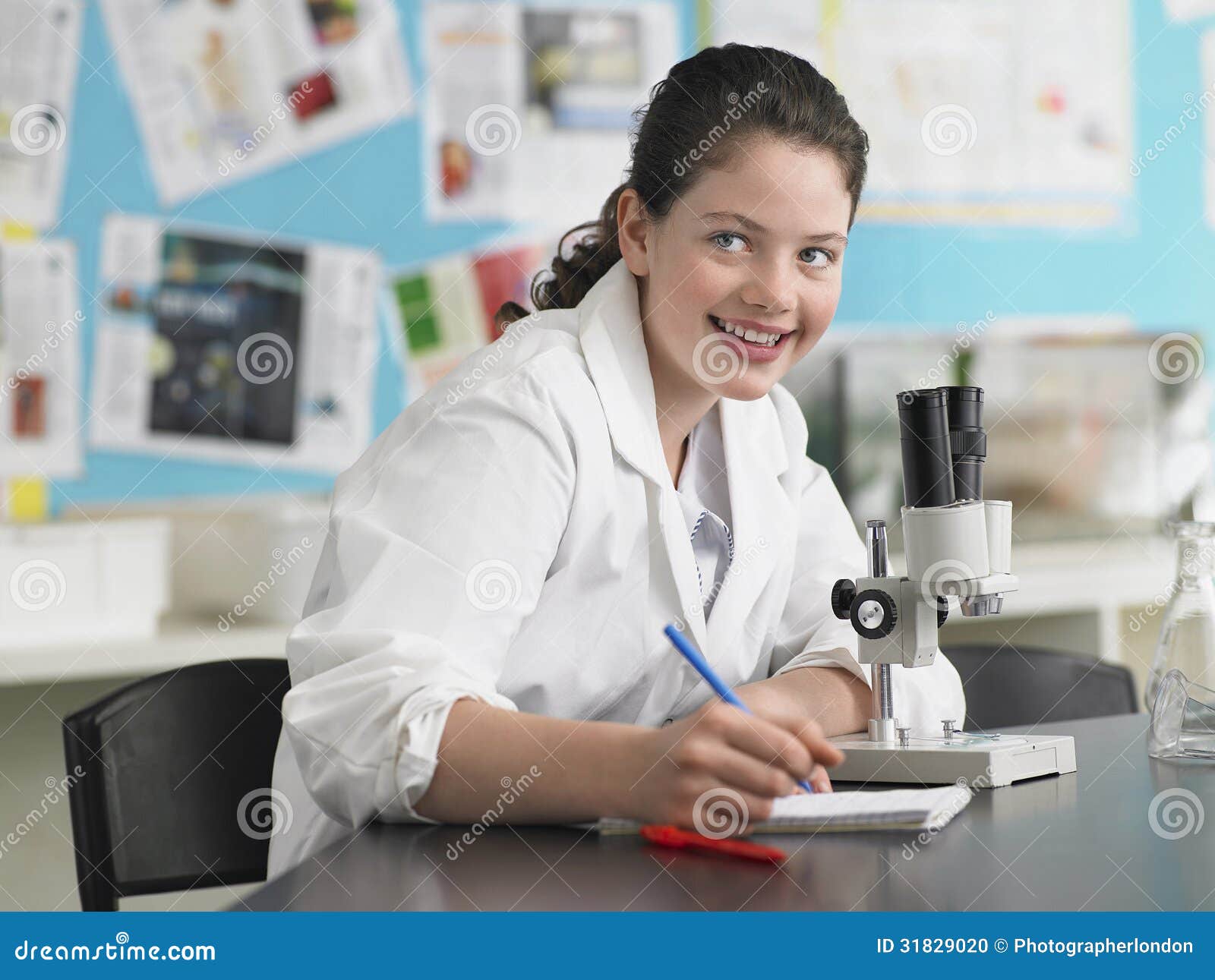 Girl Using Microscope and Taking Notes Stock Photo - Image of away ...