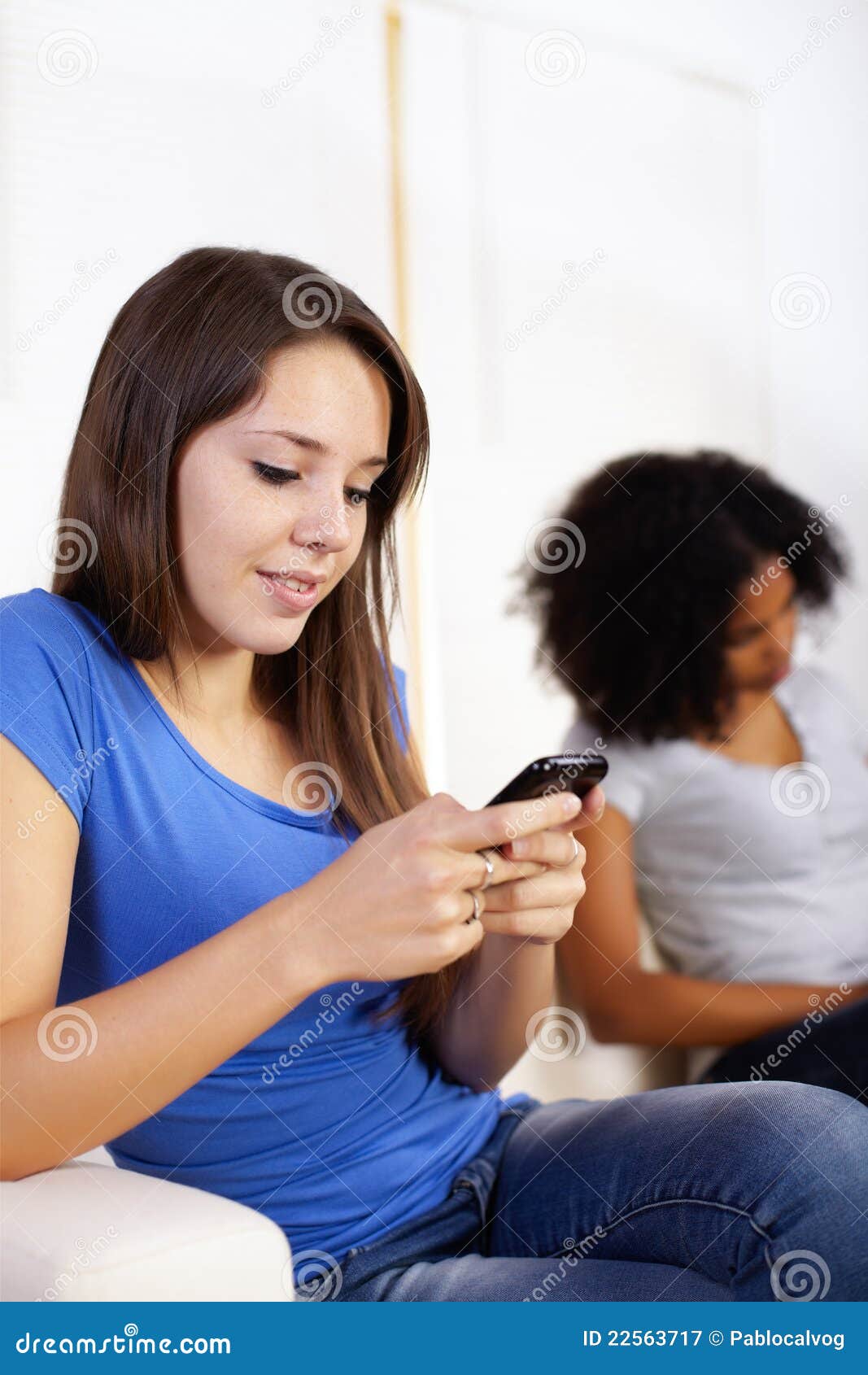 Girl using a mobile phone stock image. Image of light - 22563717