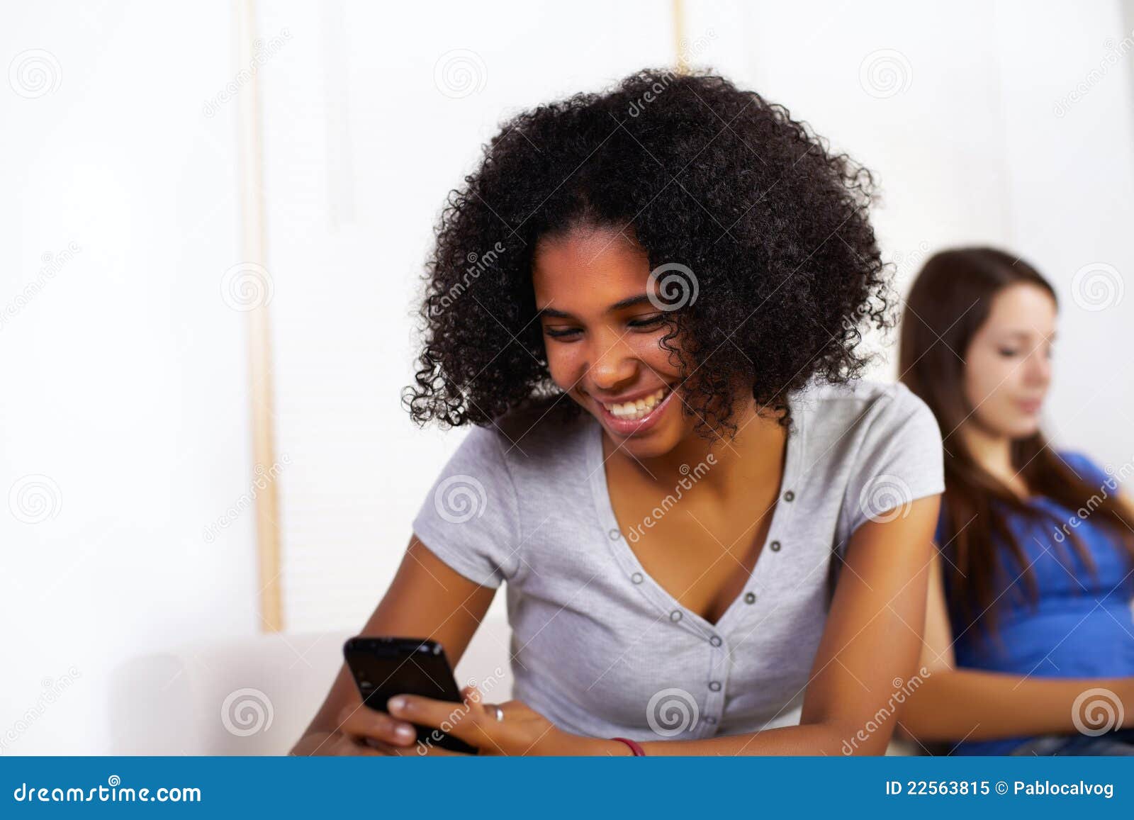Girl using a mobile phone stock image. Image of excitement - 22563815