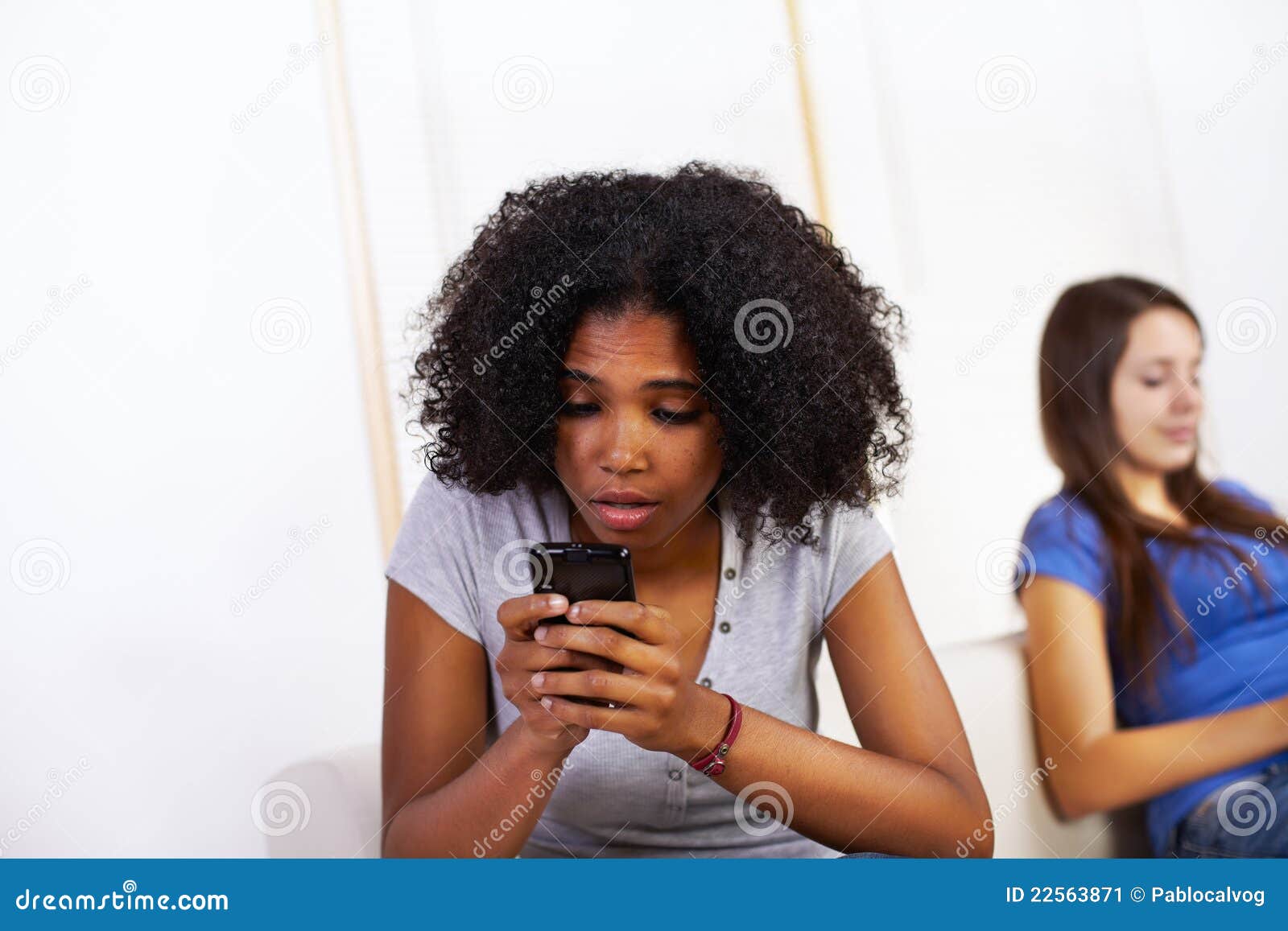 Girl using a mobile phone stock image. Image of excitement - 22563871