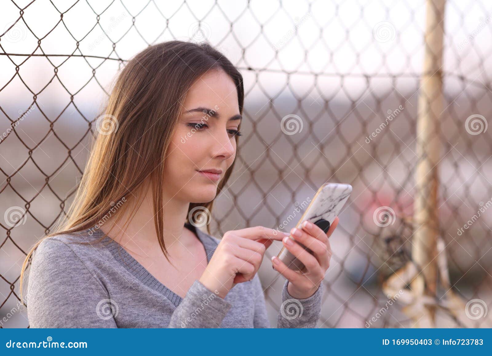Girl Using a Mobile Phone in the Street Stock Image - Image of hand ...