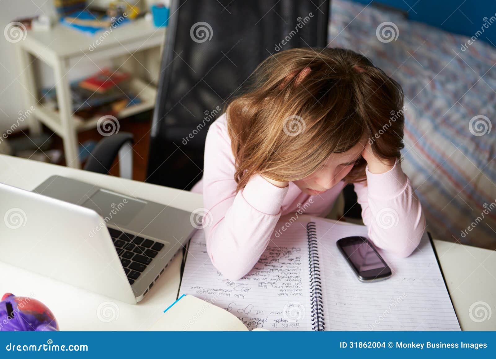 Girl Using Mobile Phone instead of Studying in Bedroom Stock Photo ...
