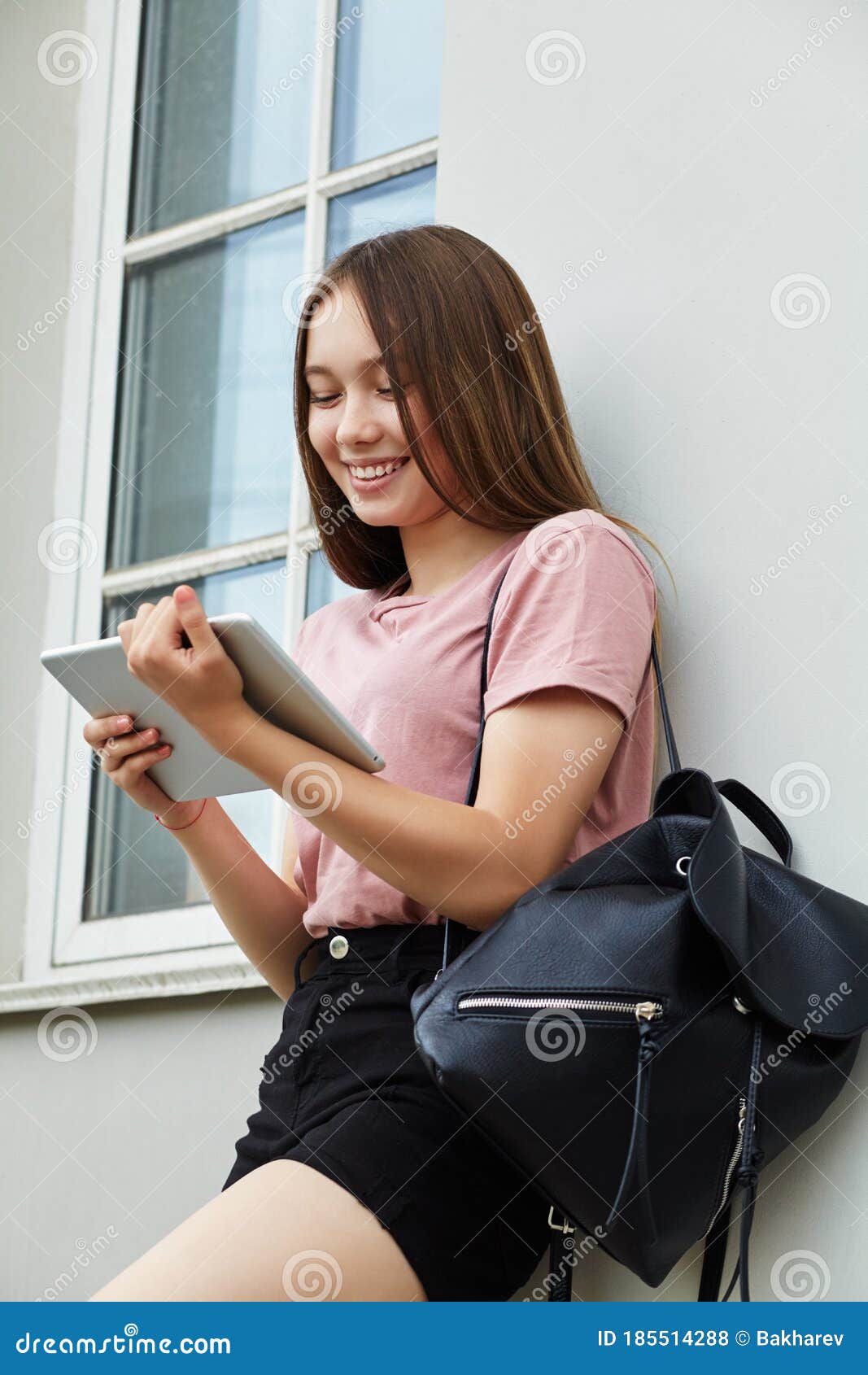 Girl Using a Tablet Computer. Student Near University. Stock Photo ...