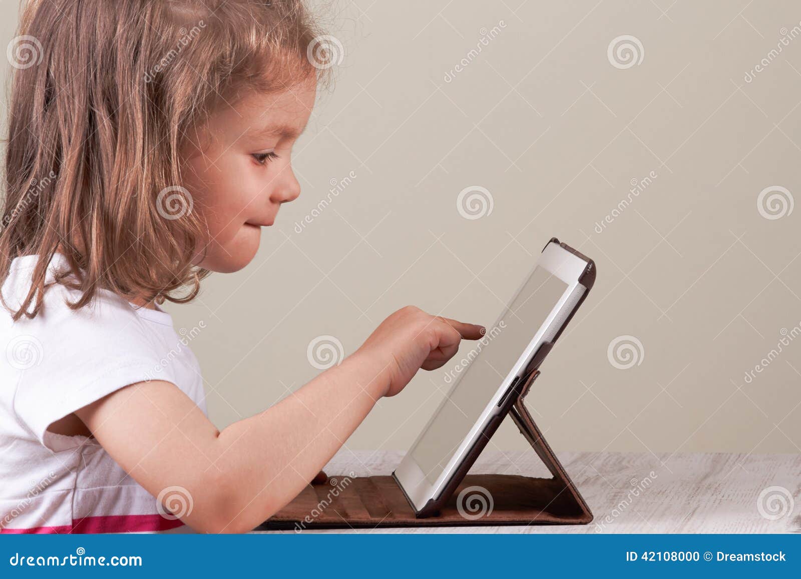 Girl using a tablet stock photo. Image of hair, happy - 42108000