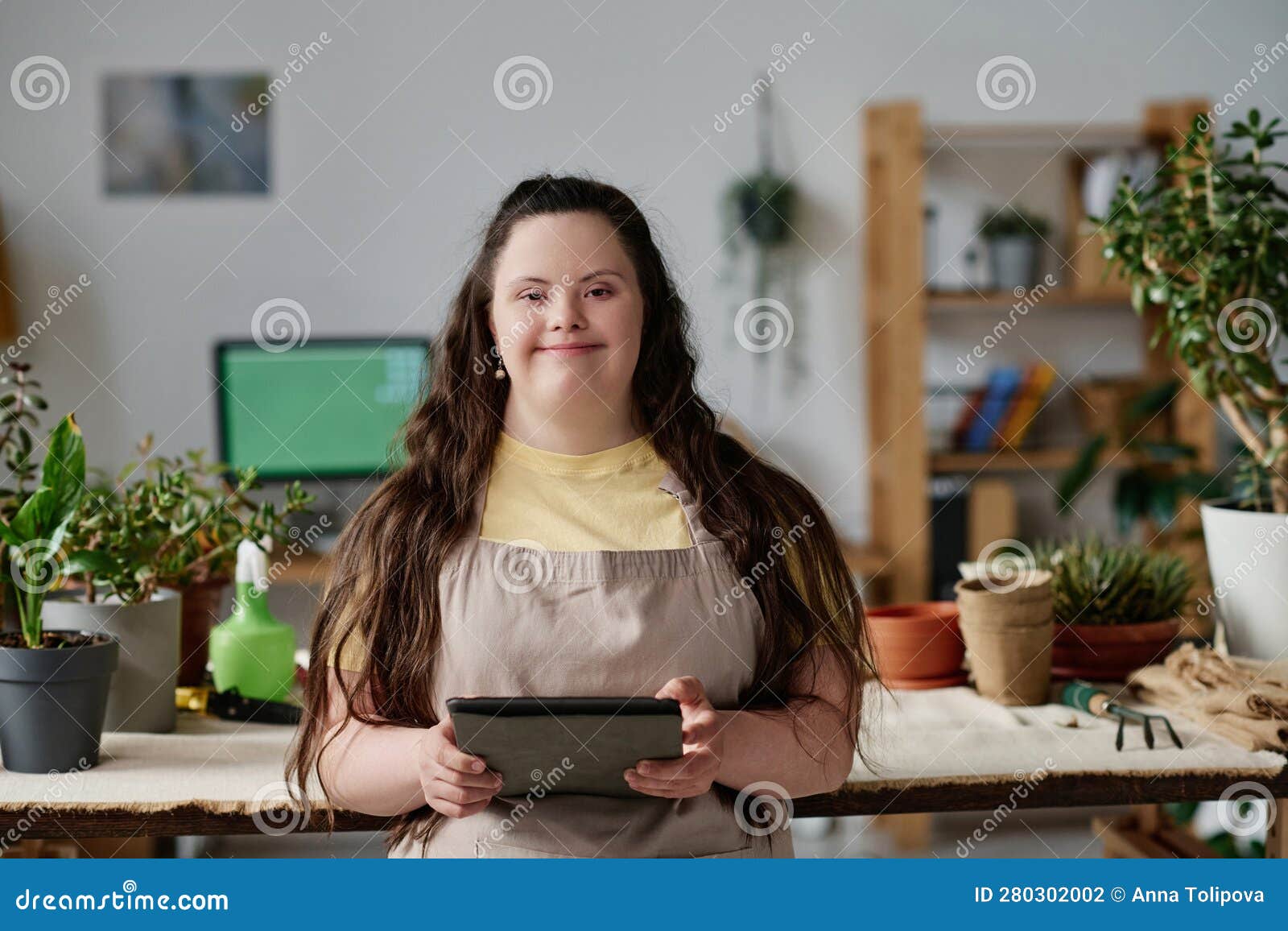 Girl Using Tablet Pc while Planting Plants Stock Photo - Image of ...