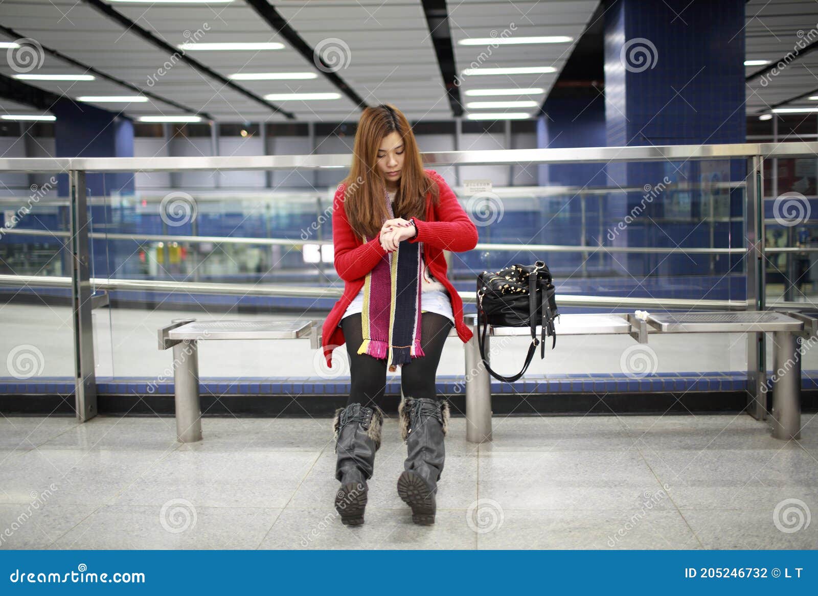 Girl Waiting Someone in the Modern Train Platform in Hong Kong Mtr ... Girl Waiting Someone in the Modern Train Platform in Hong Kong Mtr ...