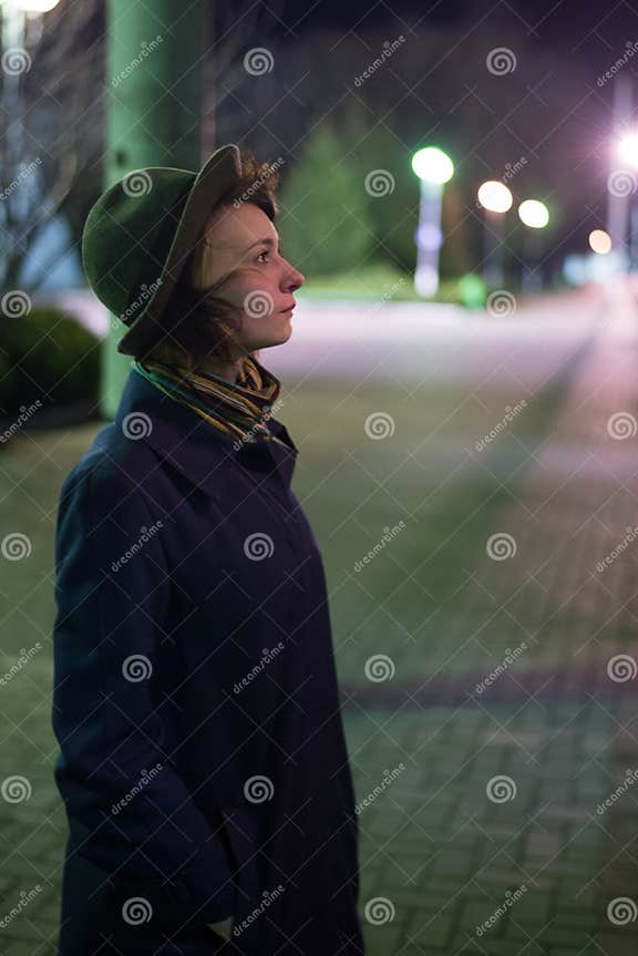 A Girl Is Waiting For Someone At Night At A Railway Station A Photo