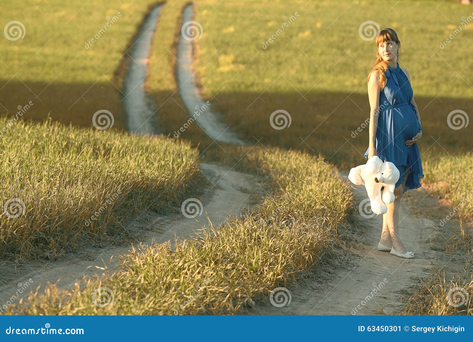 Girl Walking Along in Field Stock Image - Image of grass, belly: 63450301
