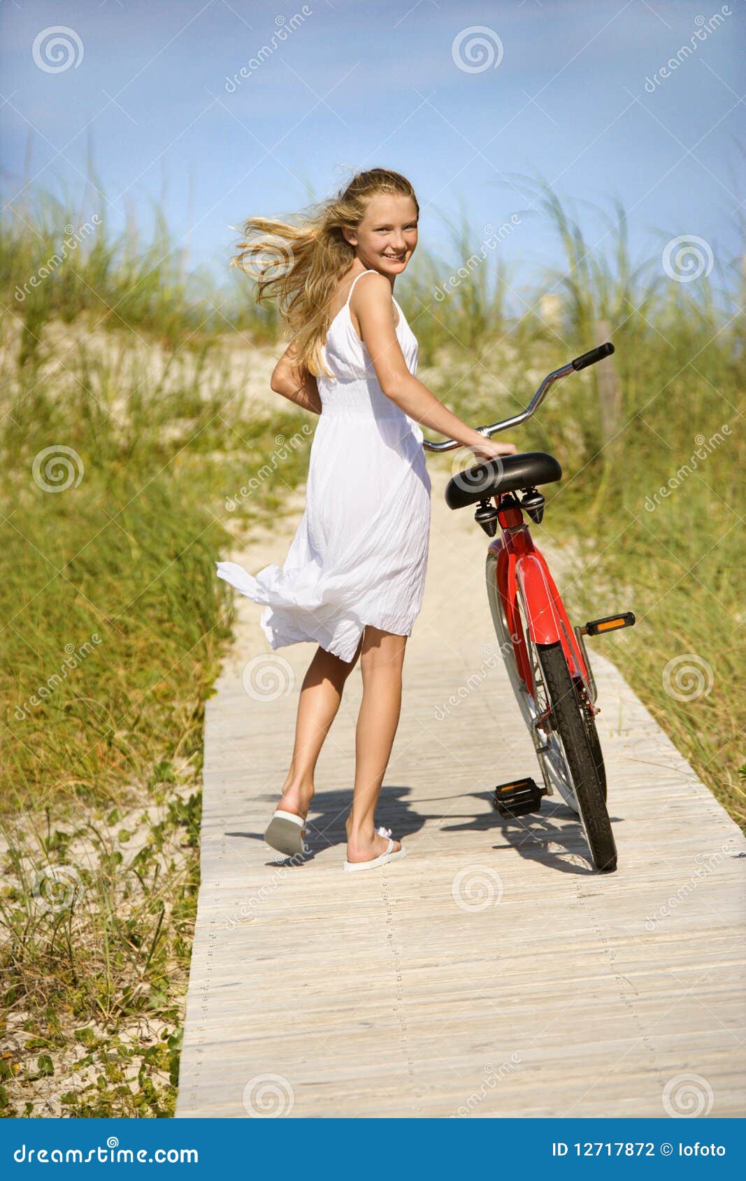 Girl Walking Bike on Boardwalk. Stock Photo - Image of looking, happy ...