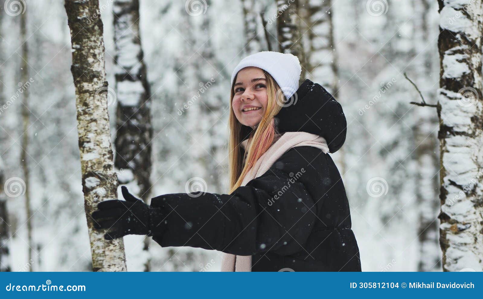 A Girl Walking in the Forest in Winter among the Birches. Stock Photo ...