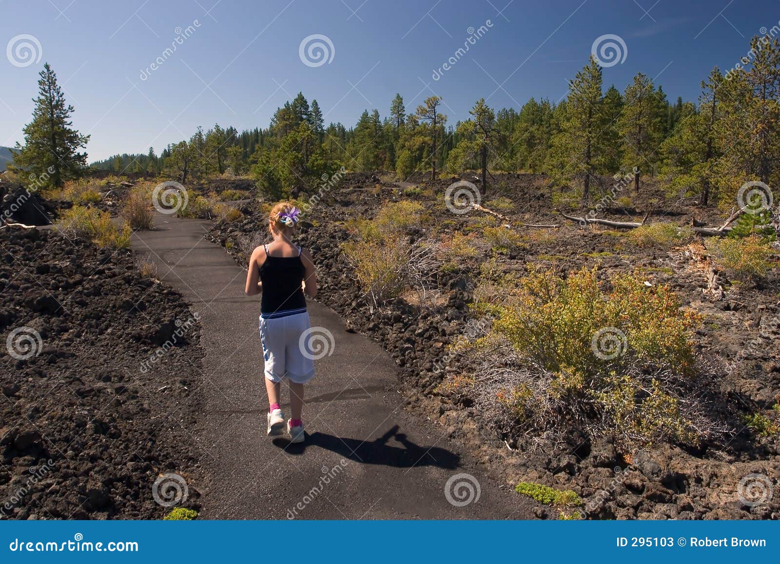Girl Walking through Lava Rocks Stock Image - Image of lava, climb: 295103