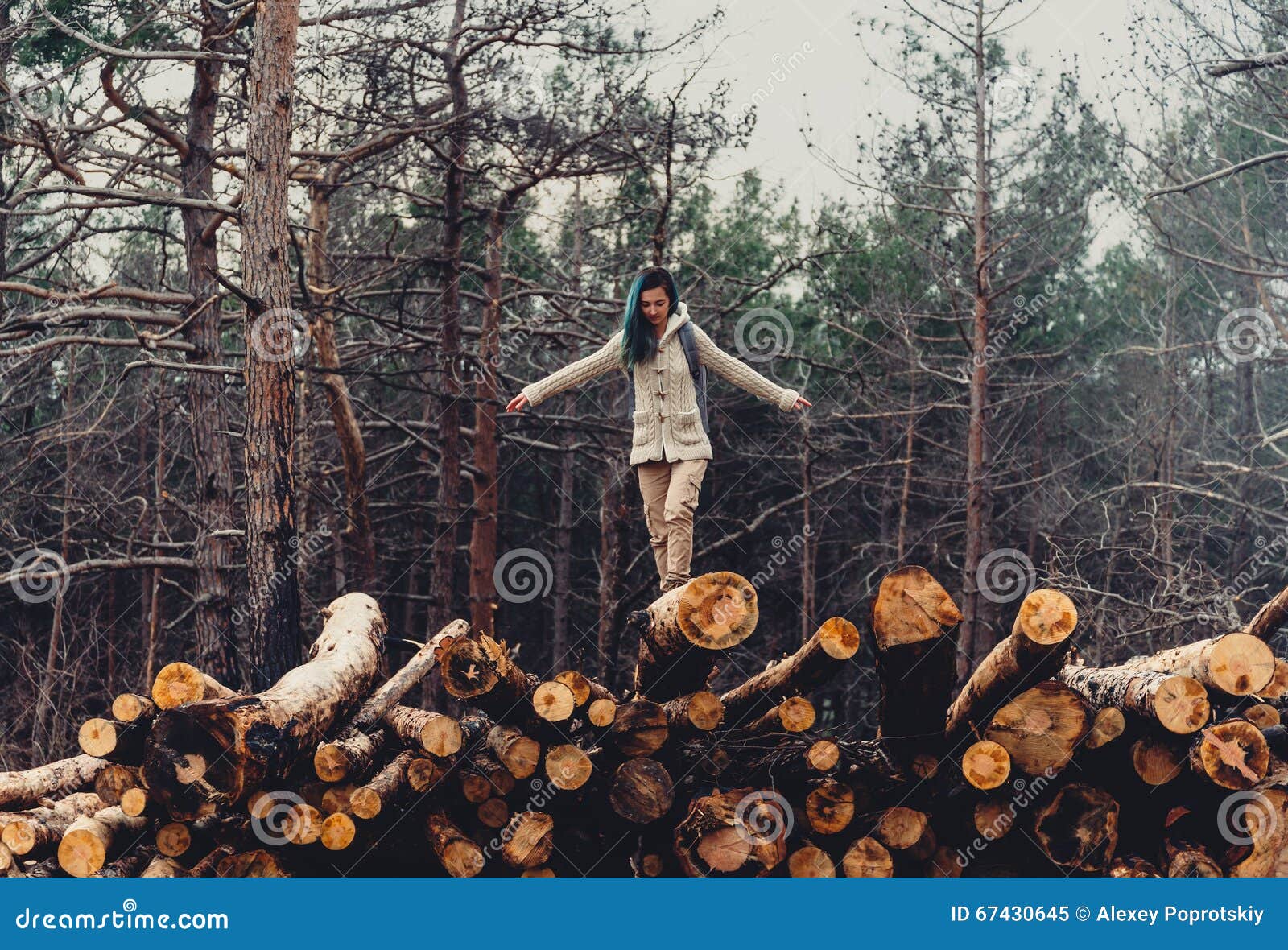 Girl Walking On Stack Of Tree Trunk Royalty-Free Stock Photography ...