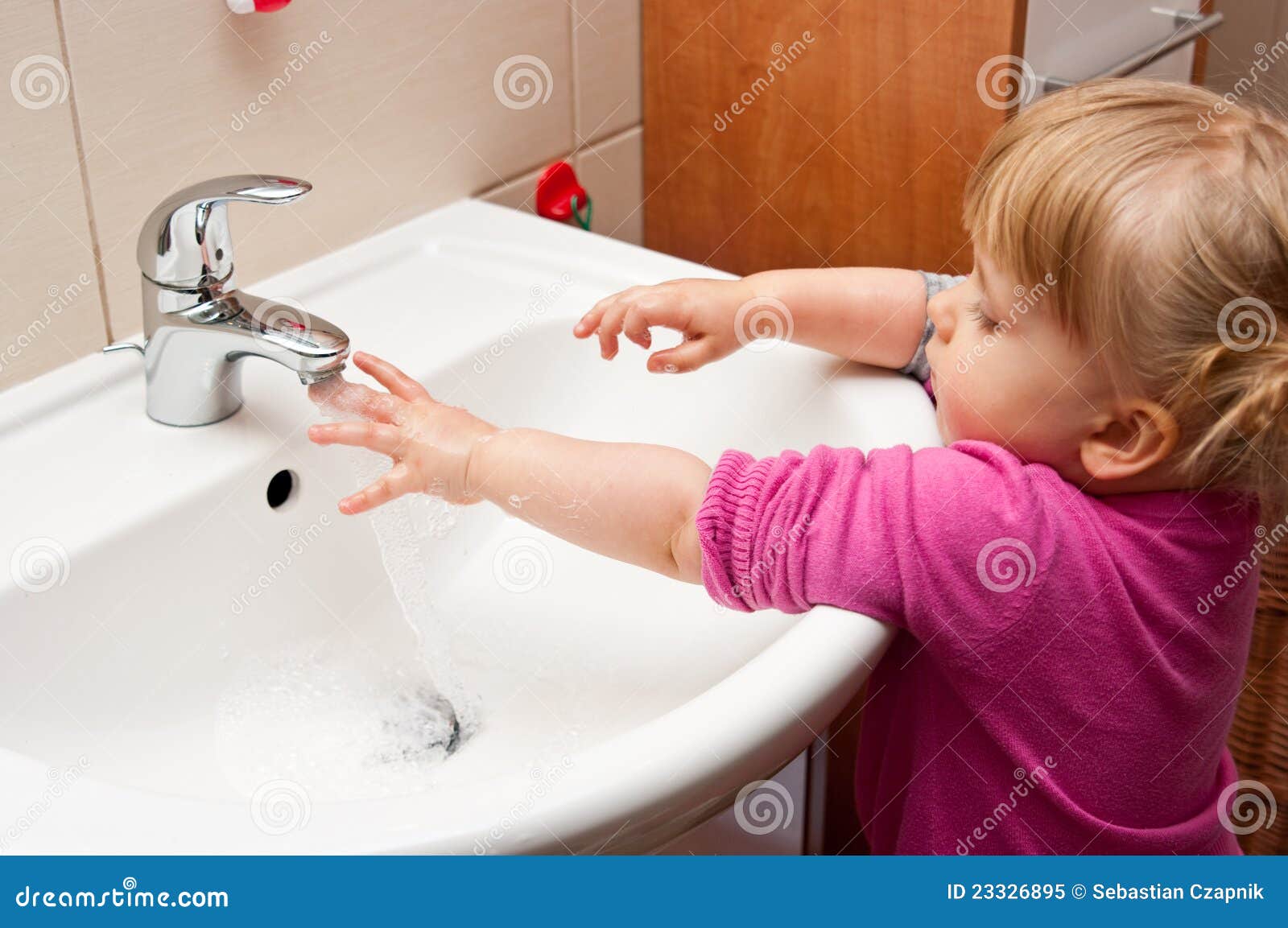 Girl wash hands stock image. Image of standing, child - 23326895