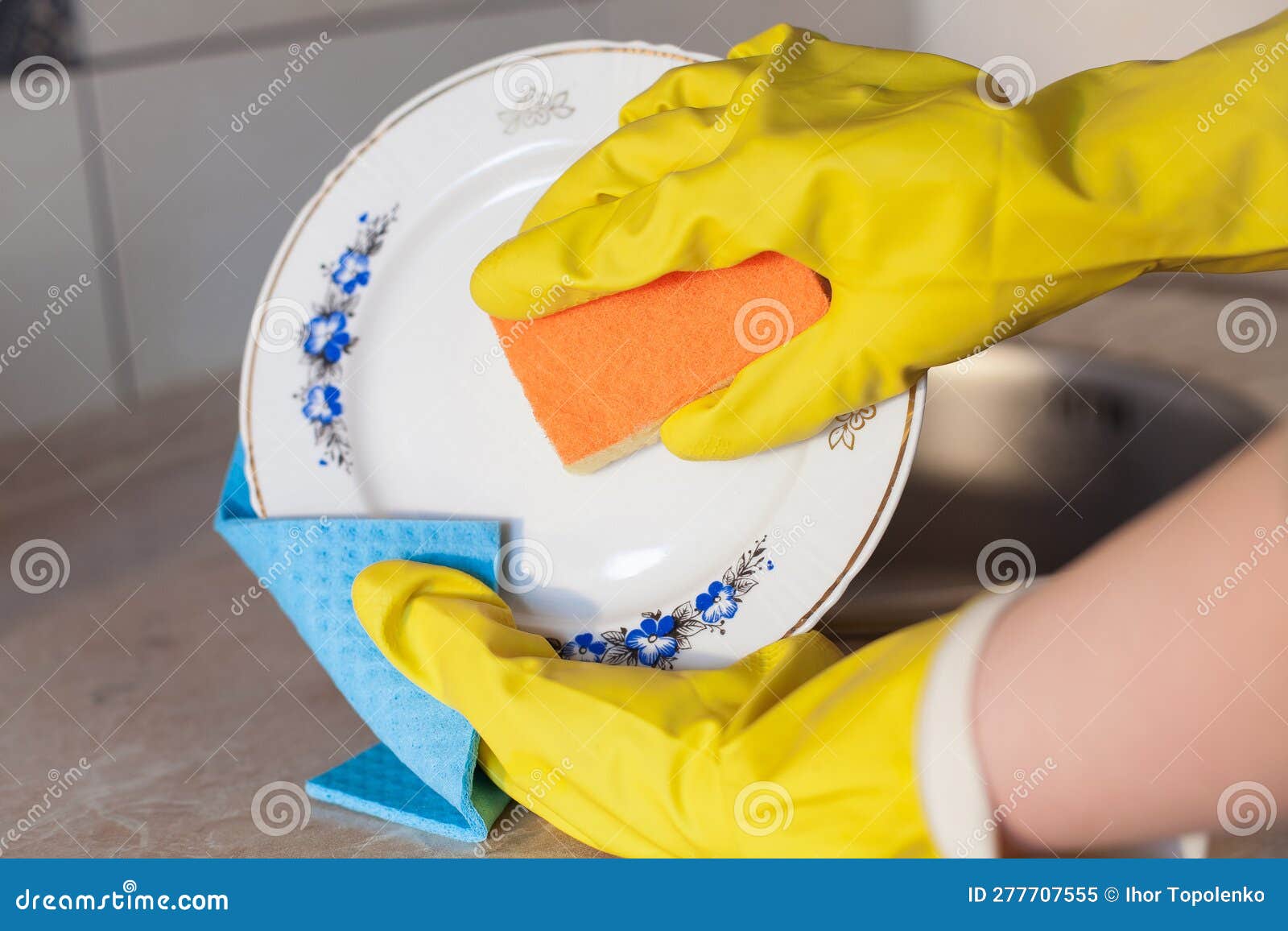 A Girl Washes a Plate with a Rag and a Sponge in the Kitchen. the Plot ...