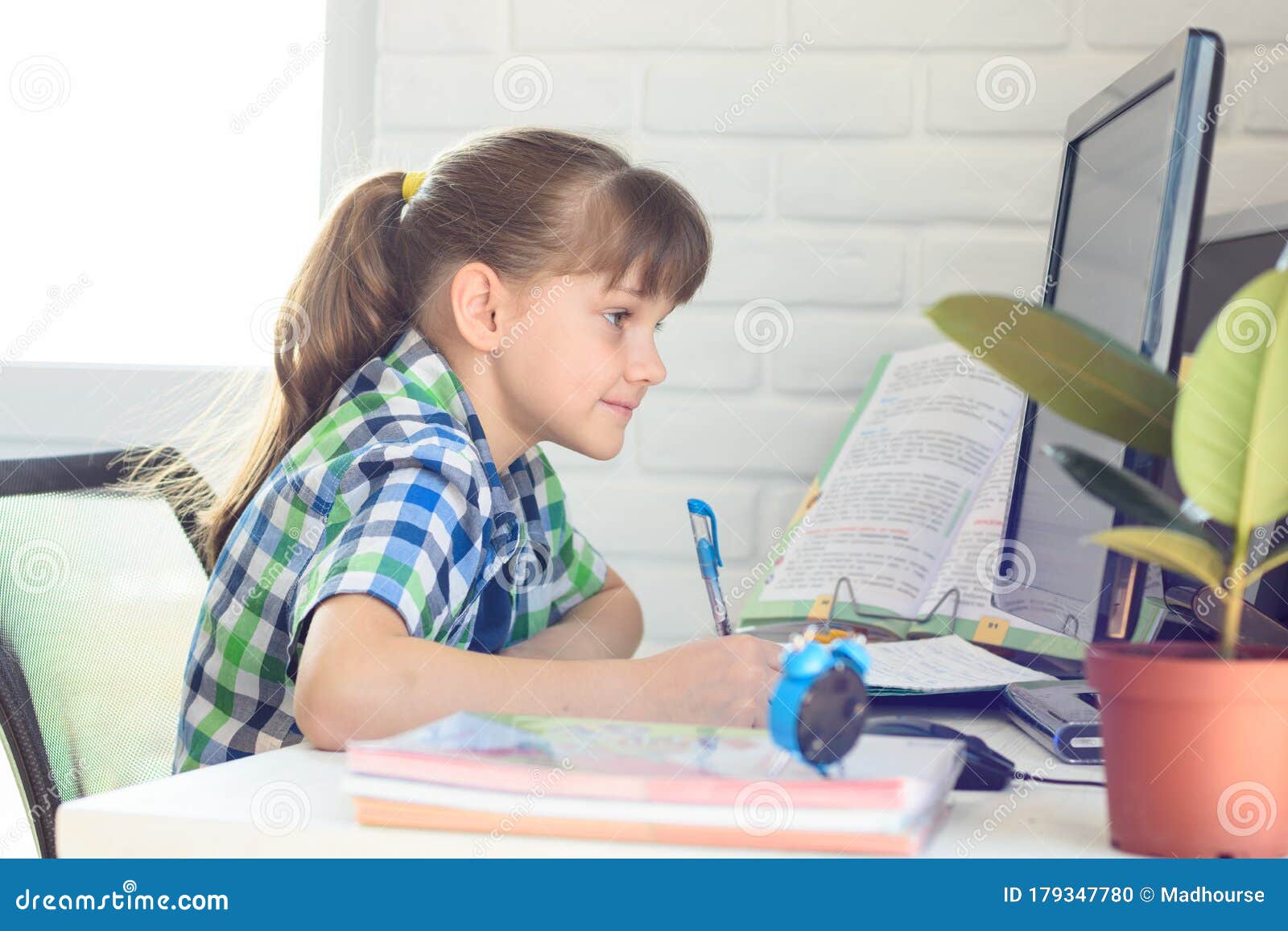 Girl Watching a Video Lesson at Home on Distance Learning Stock Photo ...