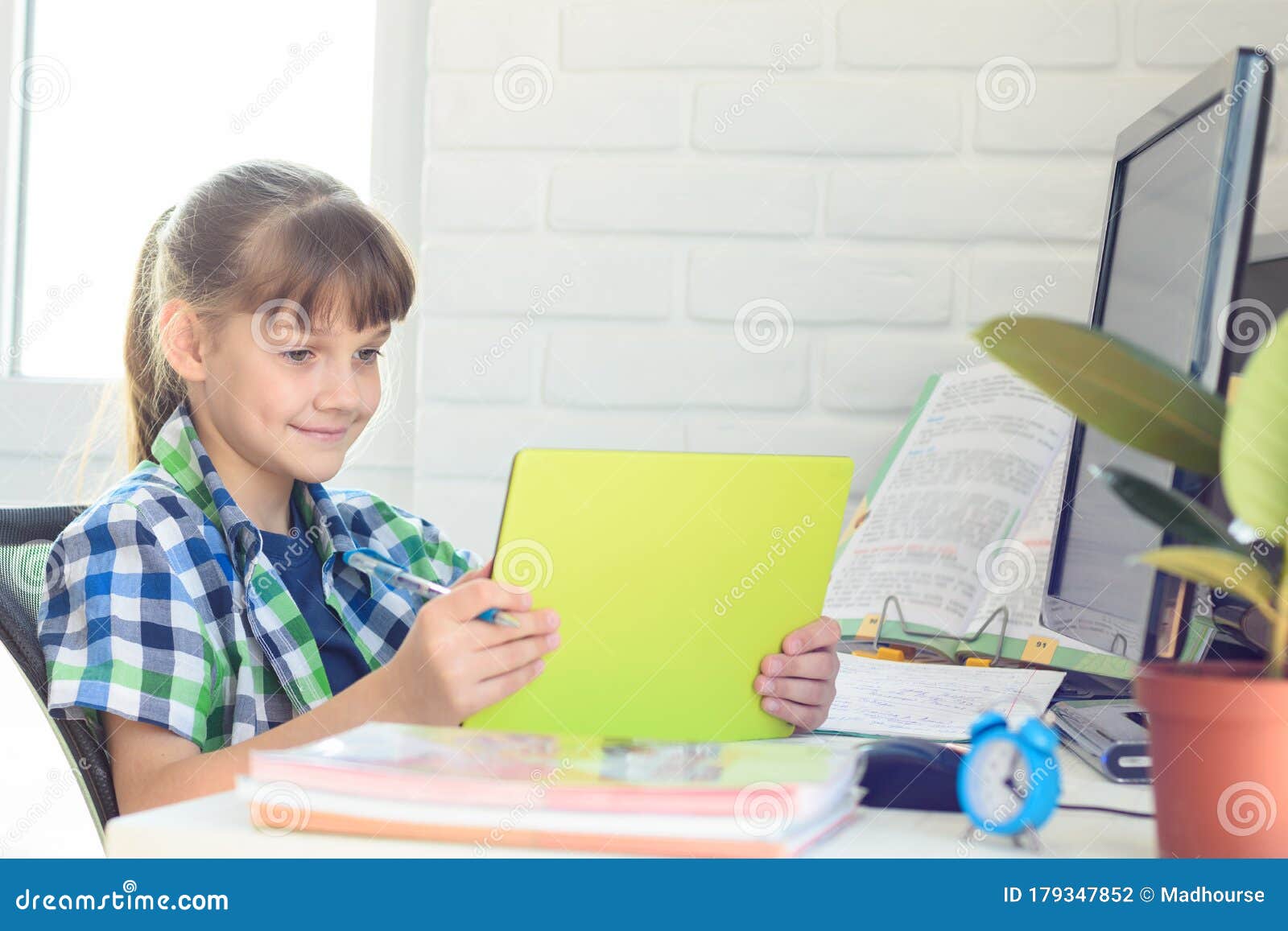 Girl Watching Video Tutorials on a Tablet while at Home Stock Photo ...