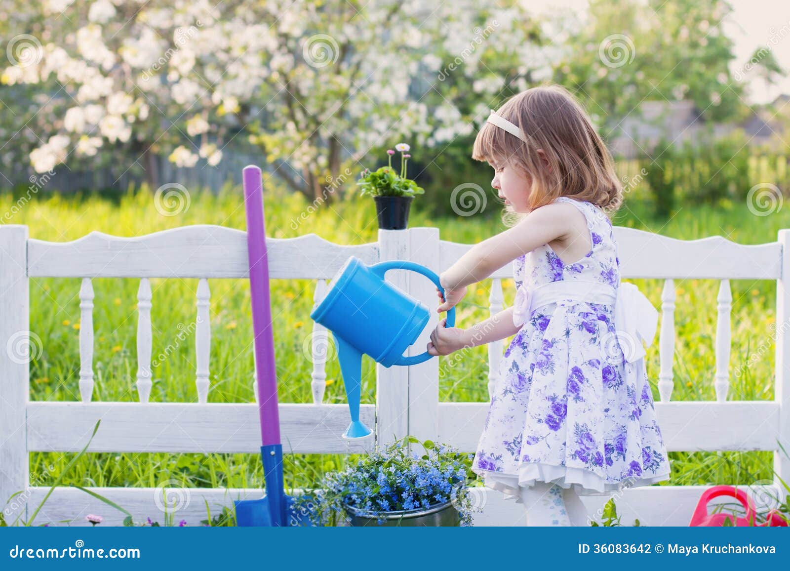 Girl Watering Spring Flowers Stock Photo - Image of picket, environment ...