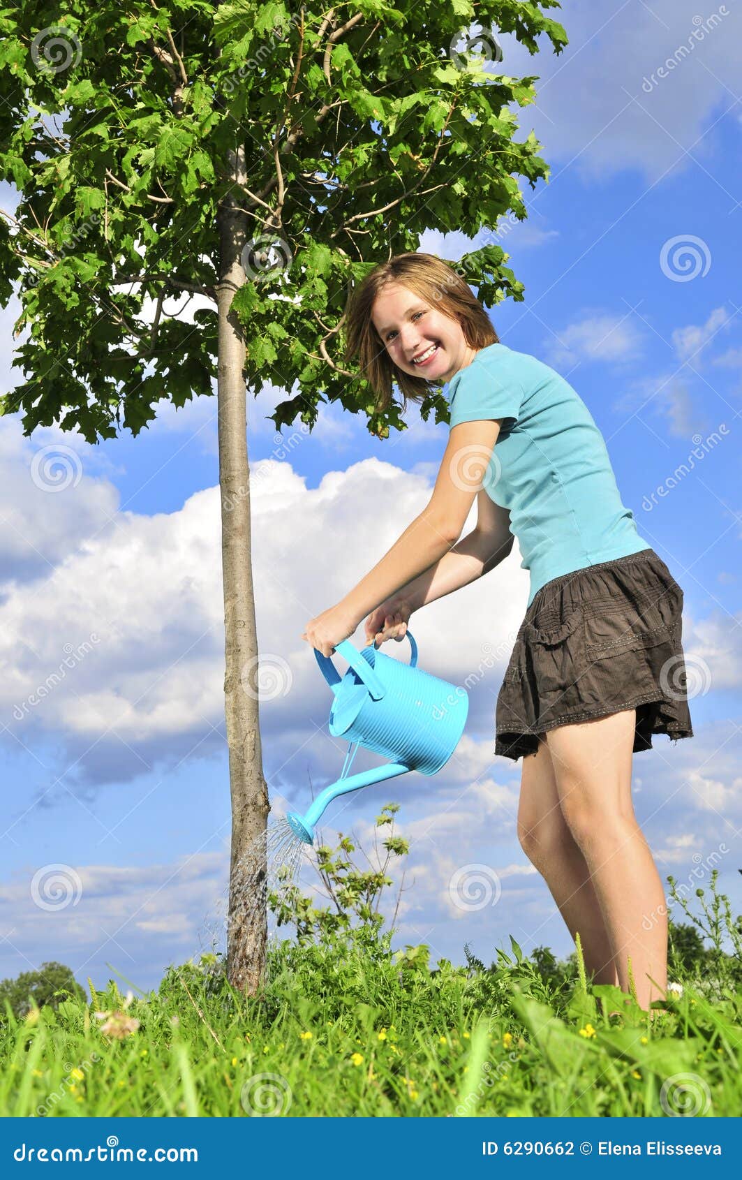 Girl watering a tree stock photo. Image of outdoor, future - 6290662
