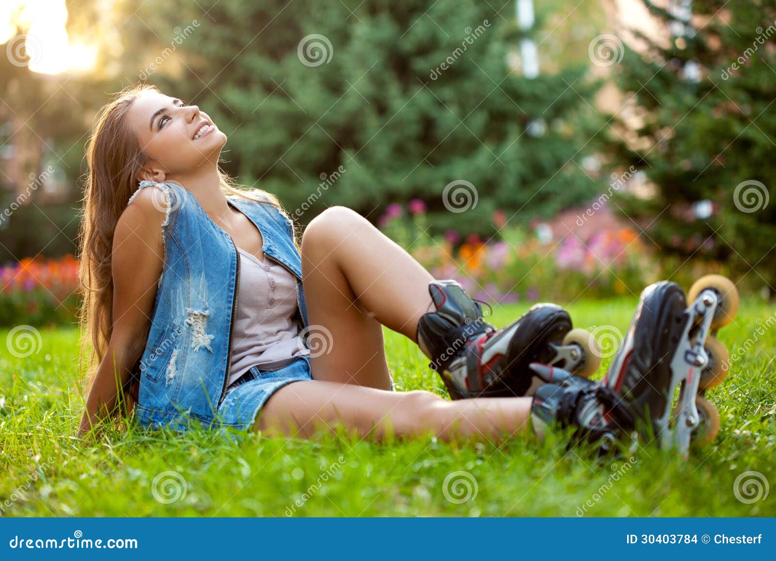 Girl Wearing Roller Skates Sitting on Grass Stock Photo - Image of ...