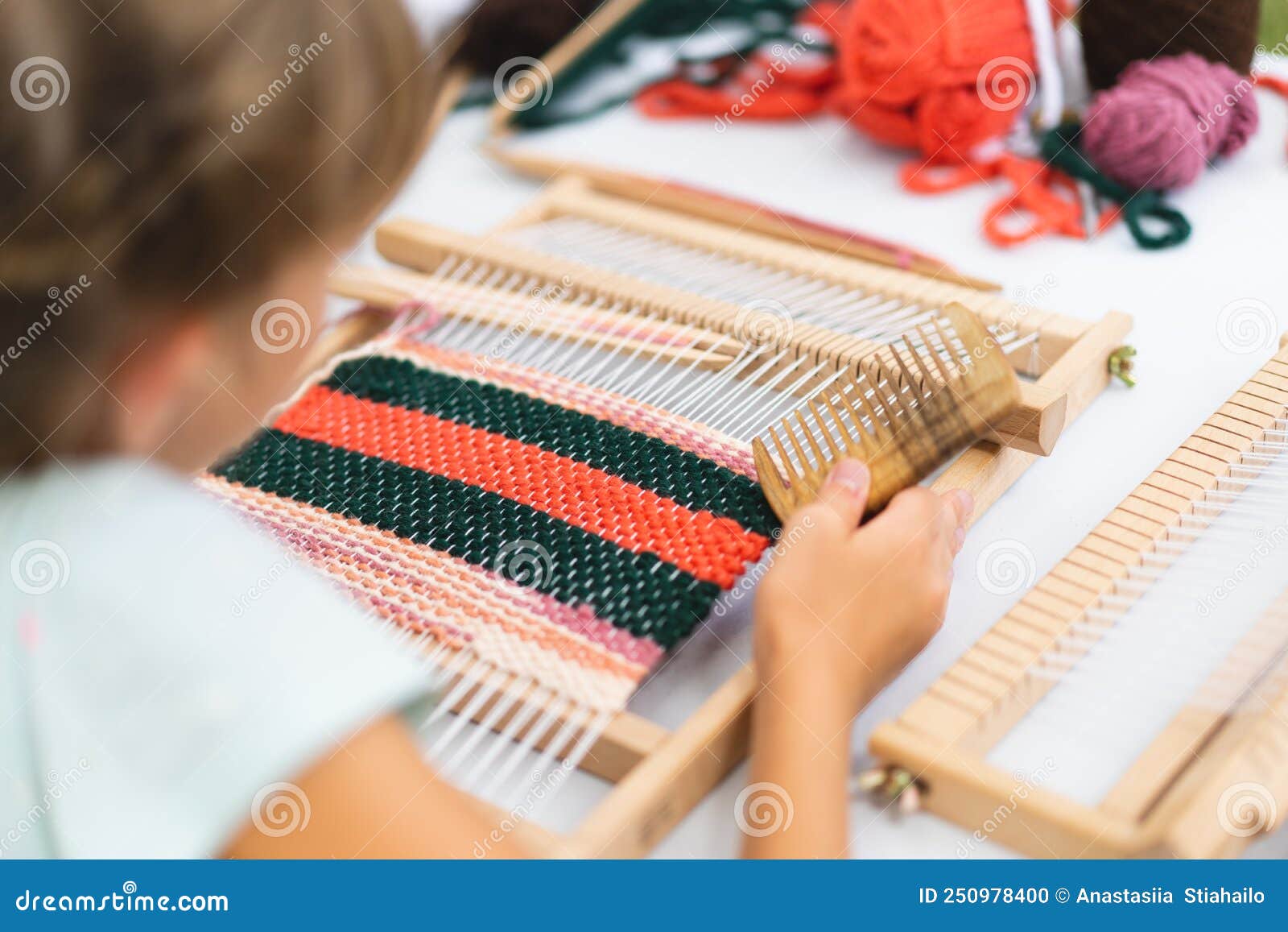 Girl Weaving Small Rug with Pattern at Masterclass on Weaving. Stock ...