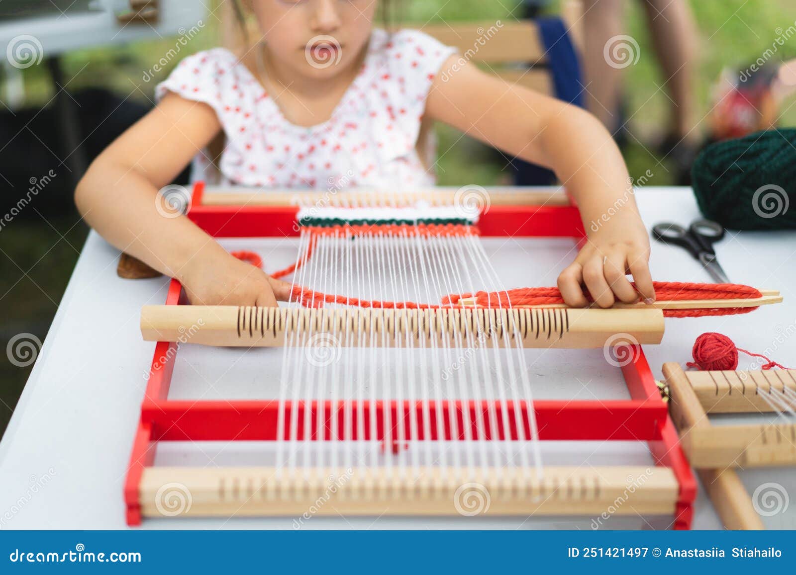 Girl Weaving Small Rug with Pattern at Masterclass on Weaving. Stock ...