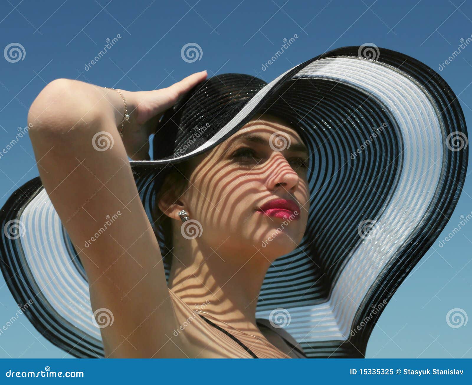 Girl in wide-brimmed hat stock image. Image of expression - 15335325