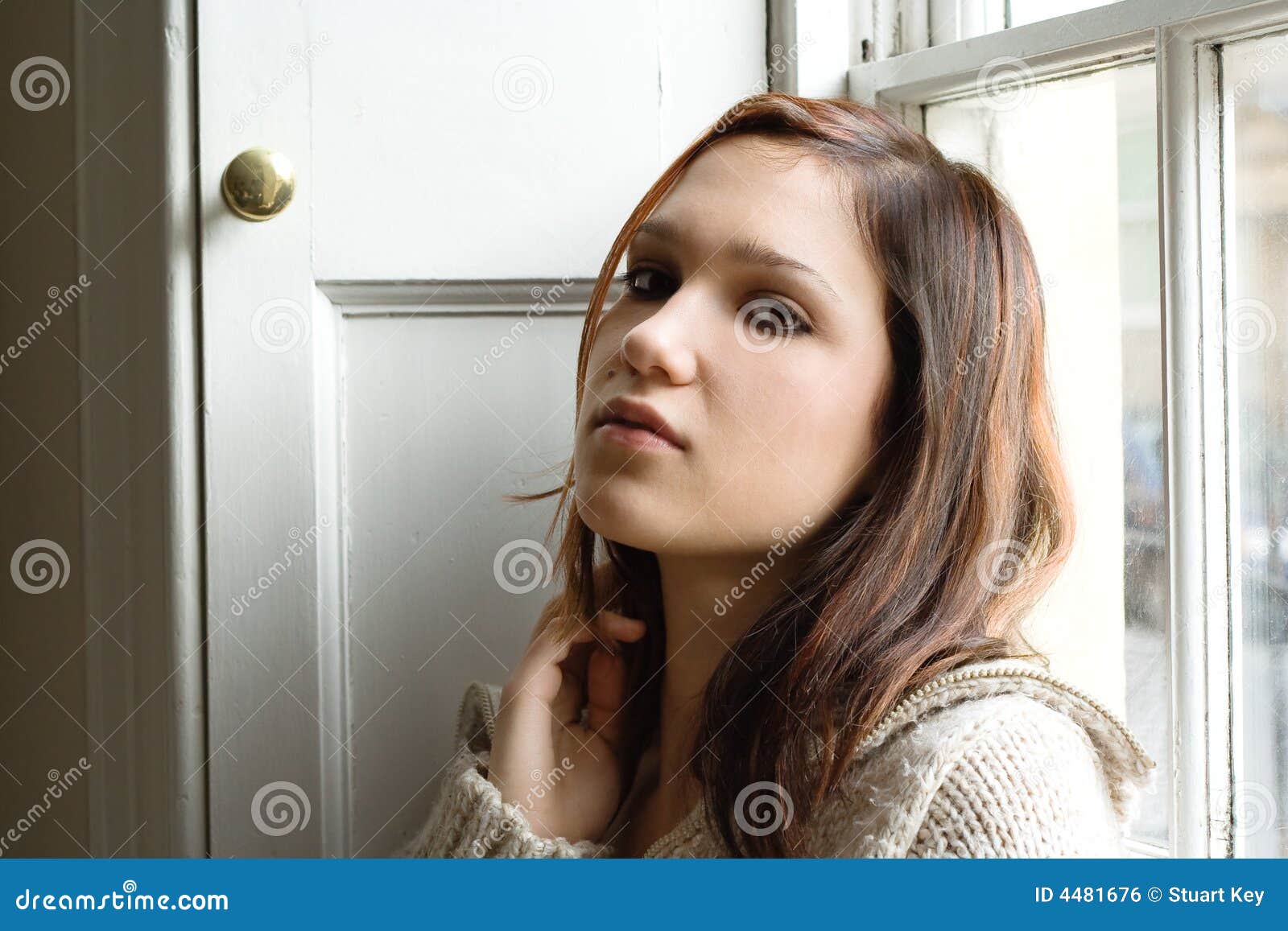 Girl at the window stock photo. Image of alluring, comfortable - 4481676
