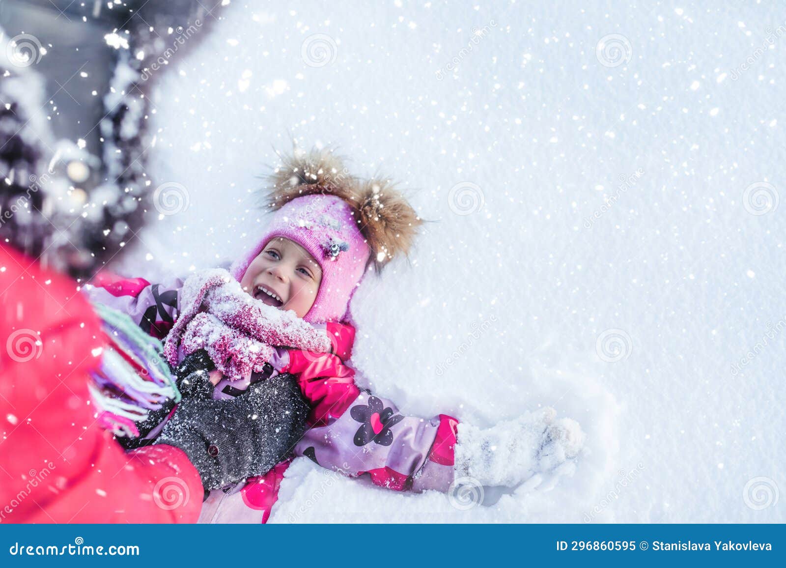 Girl in Winter Making a Snow Angel in the Snow Stock Image - Image of ...
