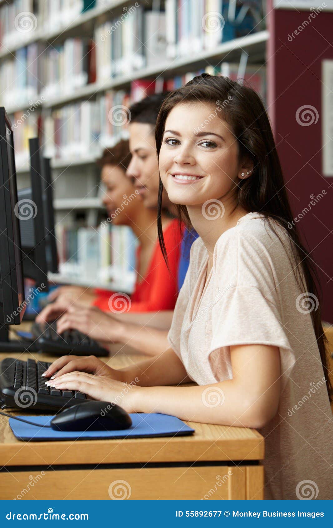 Girl Working on Computer in Library Stock Image - Image of college ...