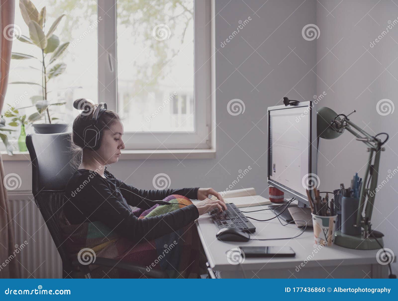 Girl working from home stock photo. Image of internet - 177436860